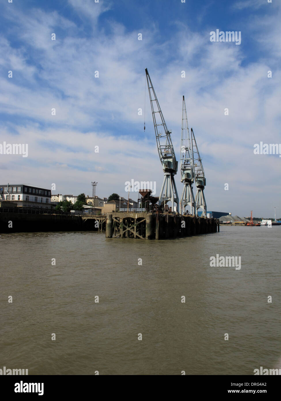 A view of the tall cranes along the riverside Stock Photo - Alamy