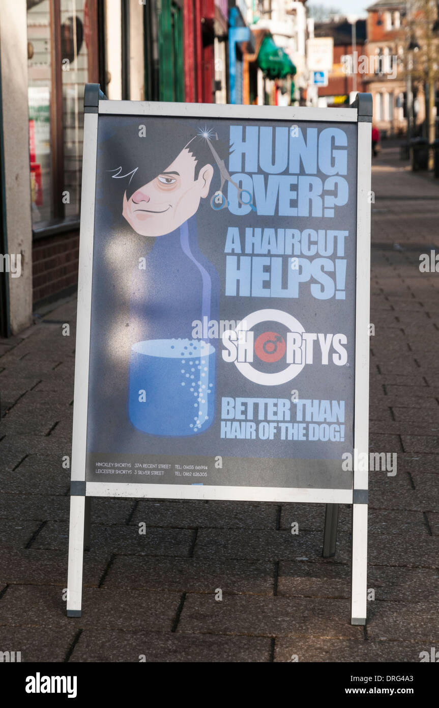 Unusual wording on a street hoarding outside a hairdressers salon Stock ...