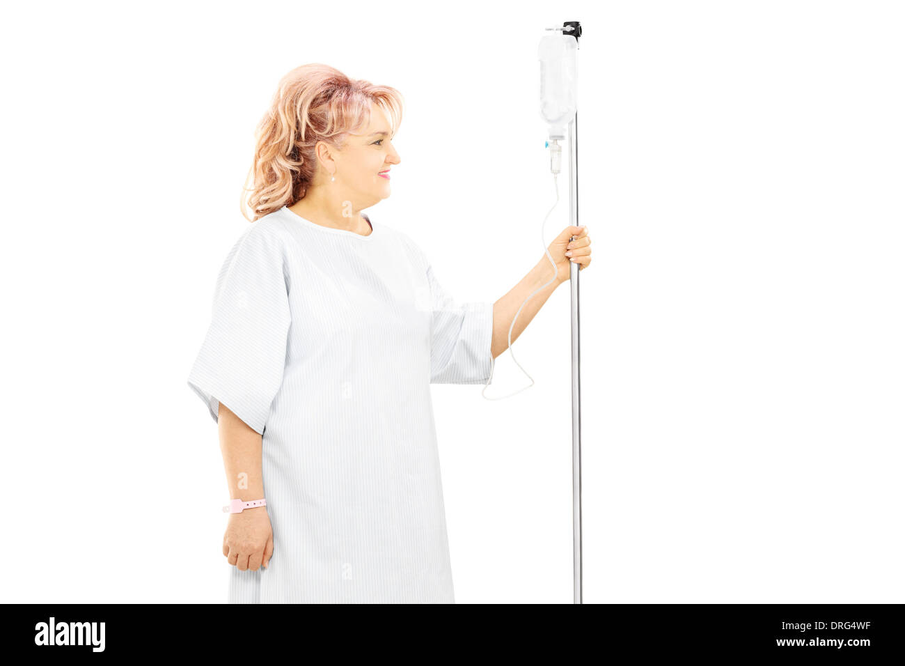 Female patient in gown getting infusion Stock Photo - Alamy