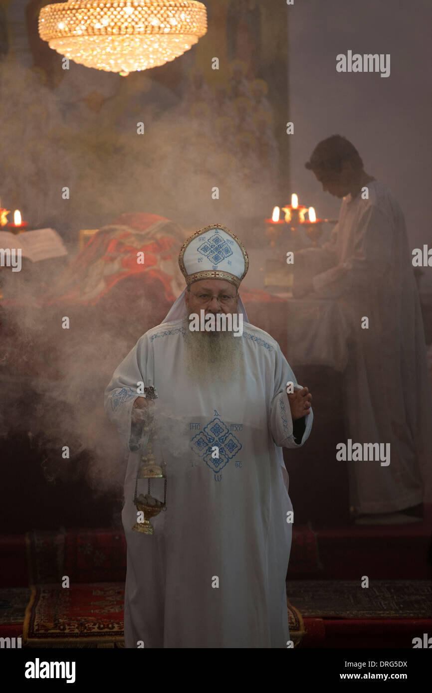 An Orthodox Coptic priest censing with thurible during a religious ...