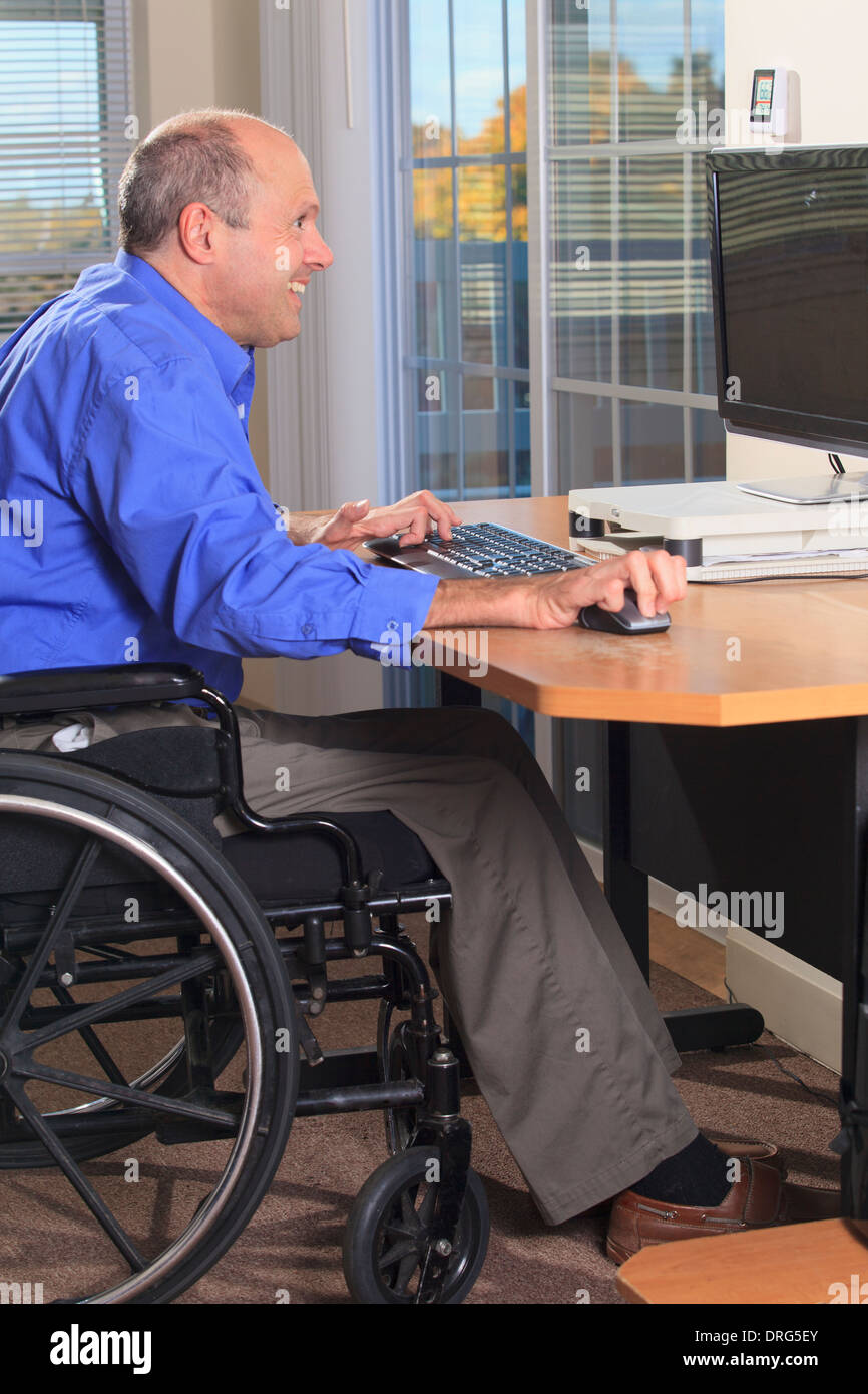Man with Friedreich's Ataxia and deformed hands using his computer ...