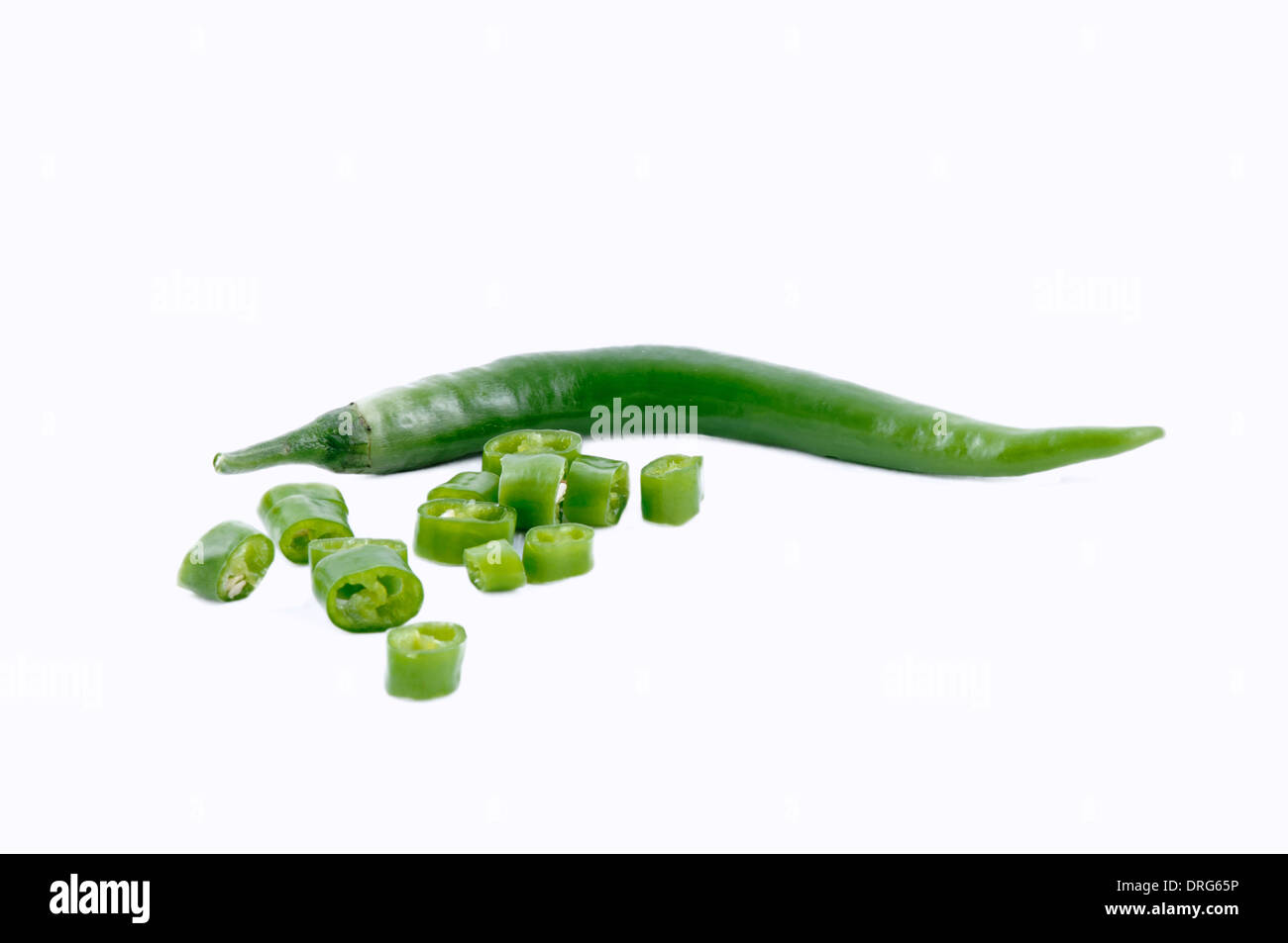 chopped green chilli on white background. studio shot Stock Photo - Alamy