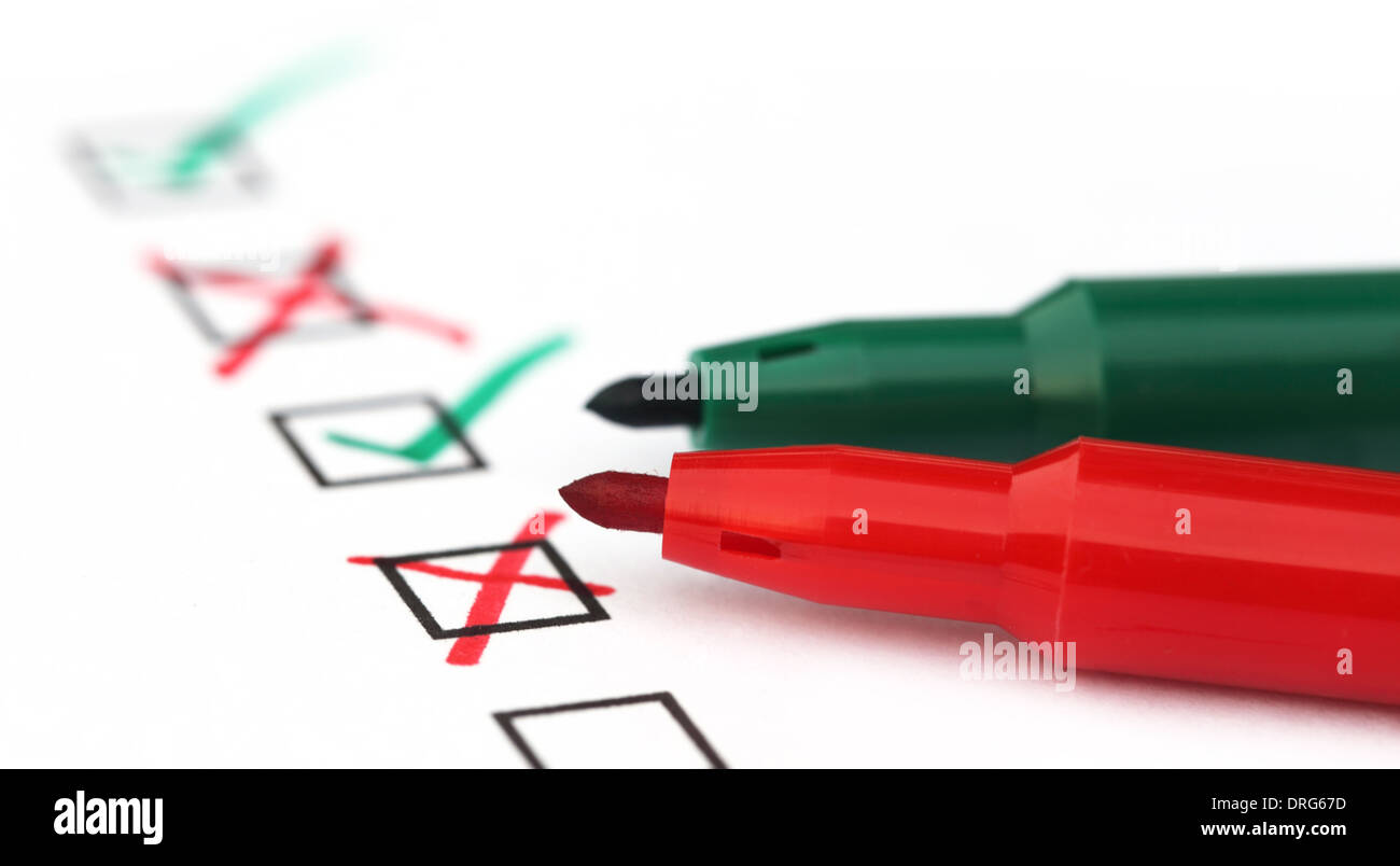 Check list with green and red pen over white paper Stock Photo - Alamy