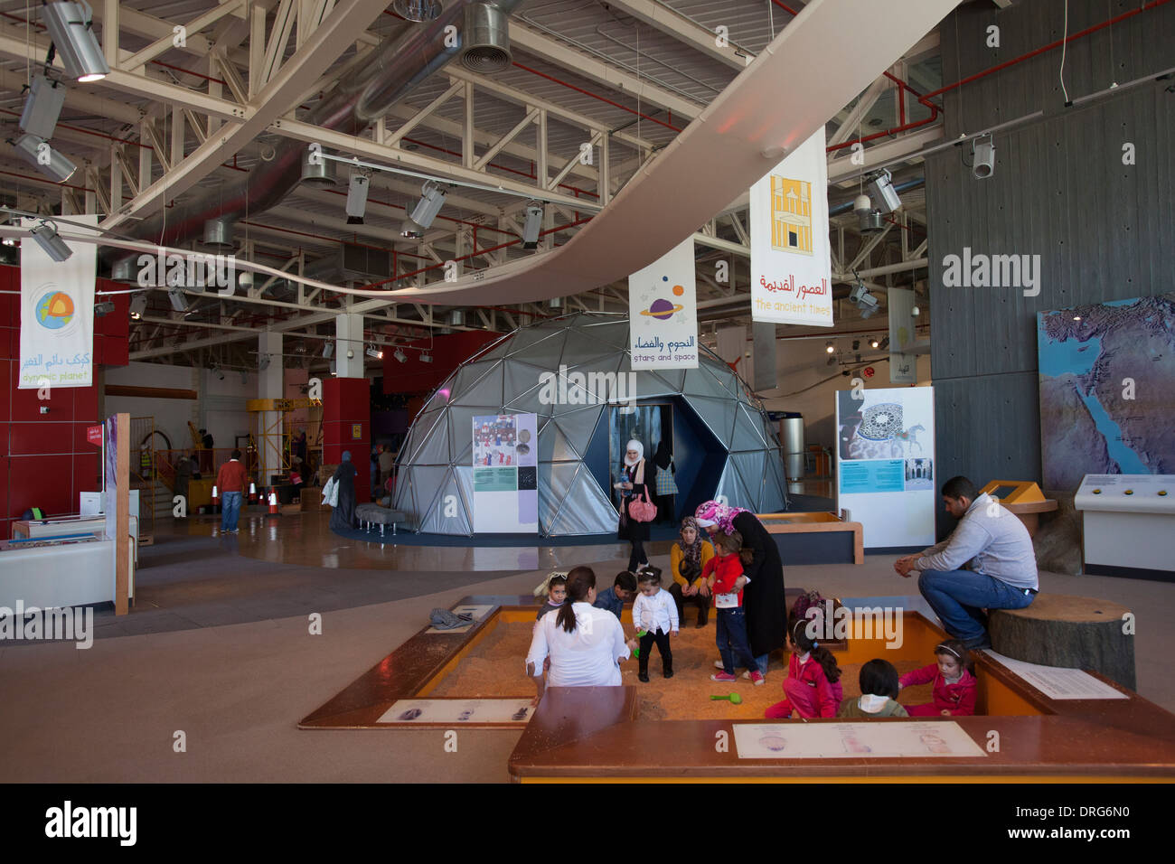 Young children playing inside the Children's Museum Jordan located in ...