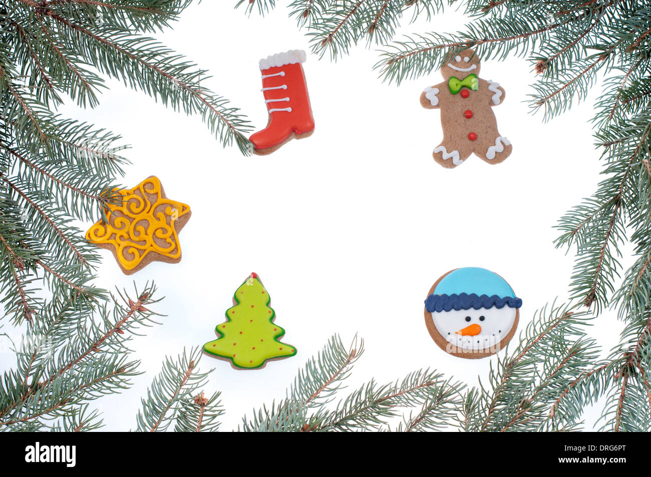 Christmas ginger cookies and a frame of fir twigs Stock Photo - Alamy