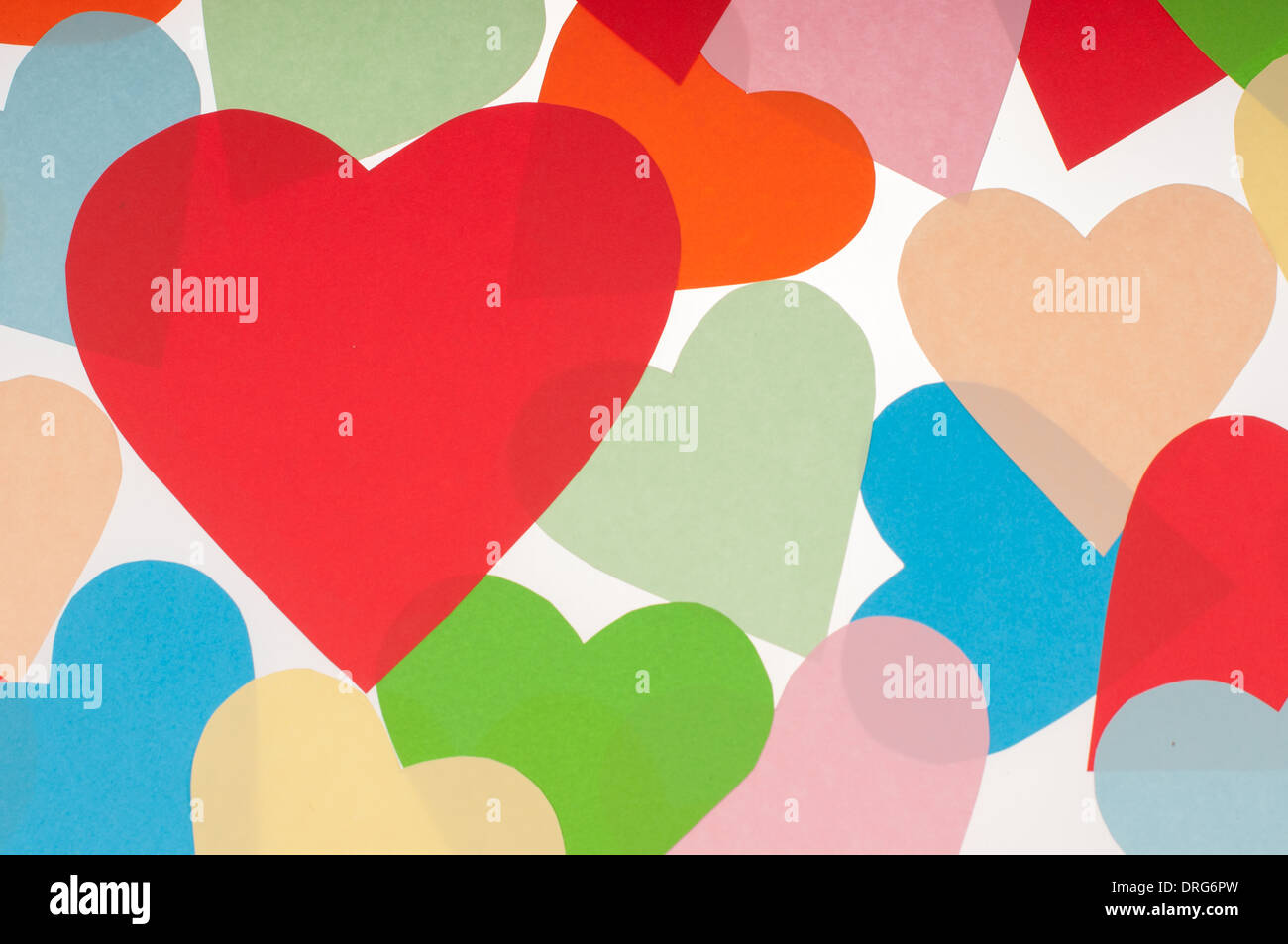 Different color paper hearts on a white background Stock Photo - Alamy