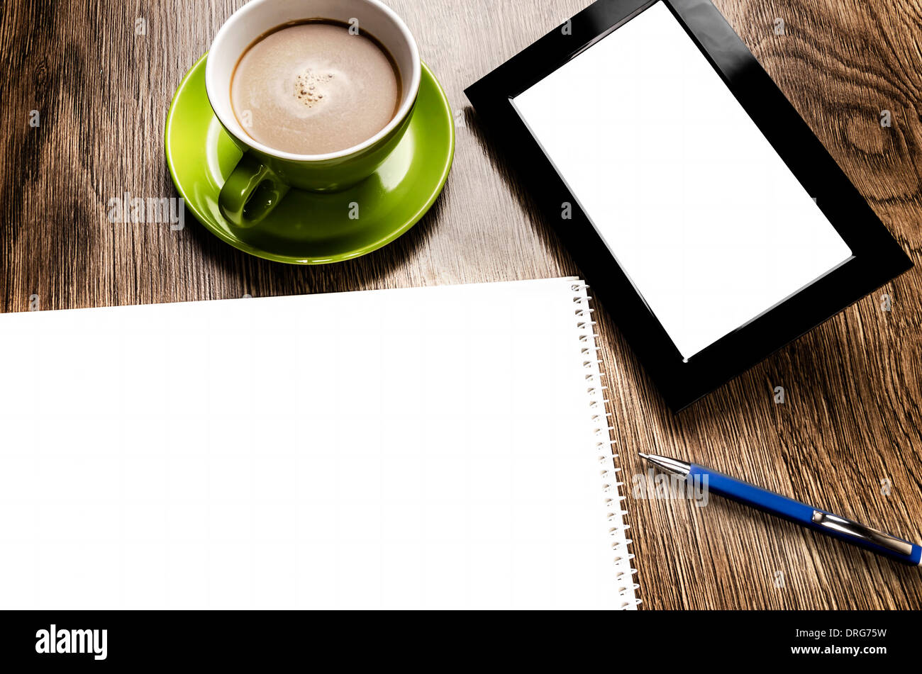 Tablet pc with blank paper and green cup of coffee Stock Photo - Alamy