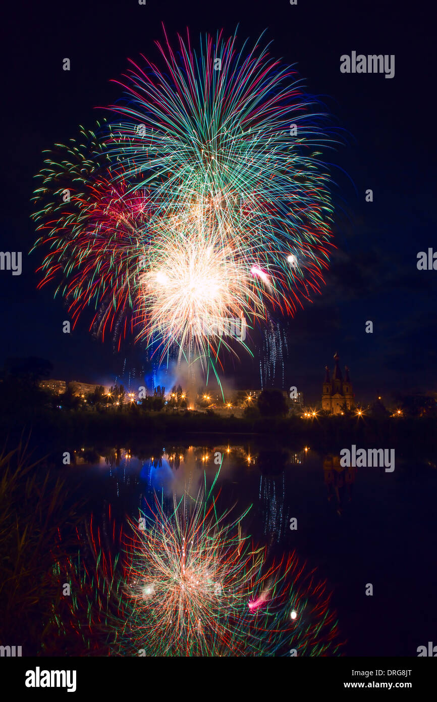 night traditional firework with reflection in water Stock Photo - Alamy