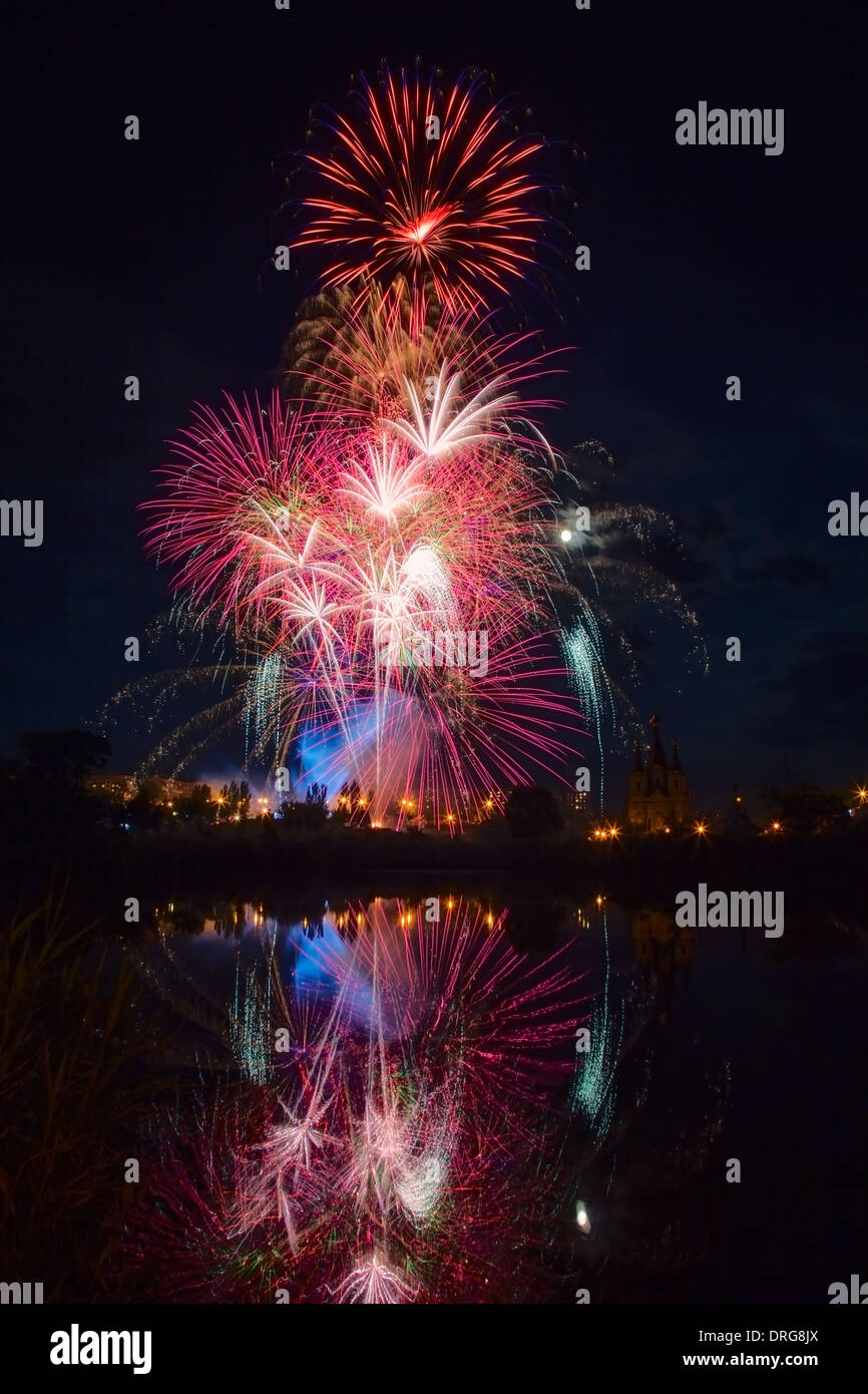 night traditional firework with reflection in water Stock Photo - Alamy