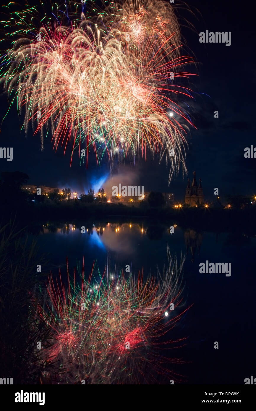 night traditional firework with reflection in water Stock Photo - Alamy