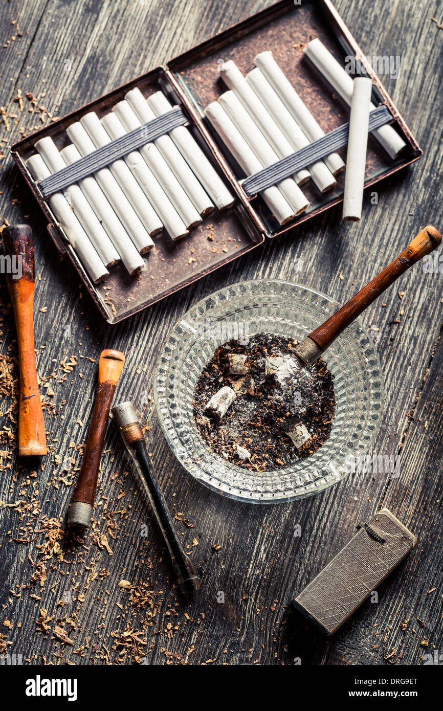 Smoked a wooden pipe with cigarettes Stock Photo - Alamy
