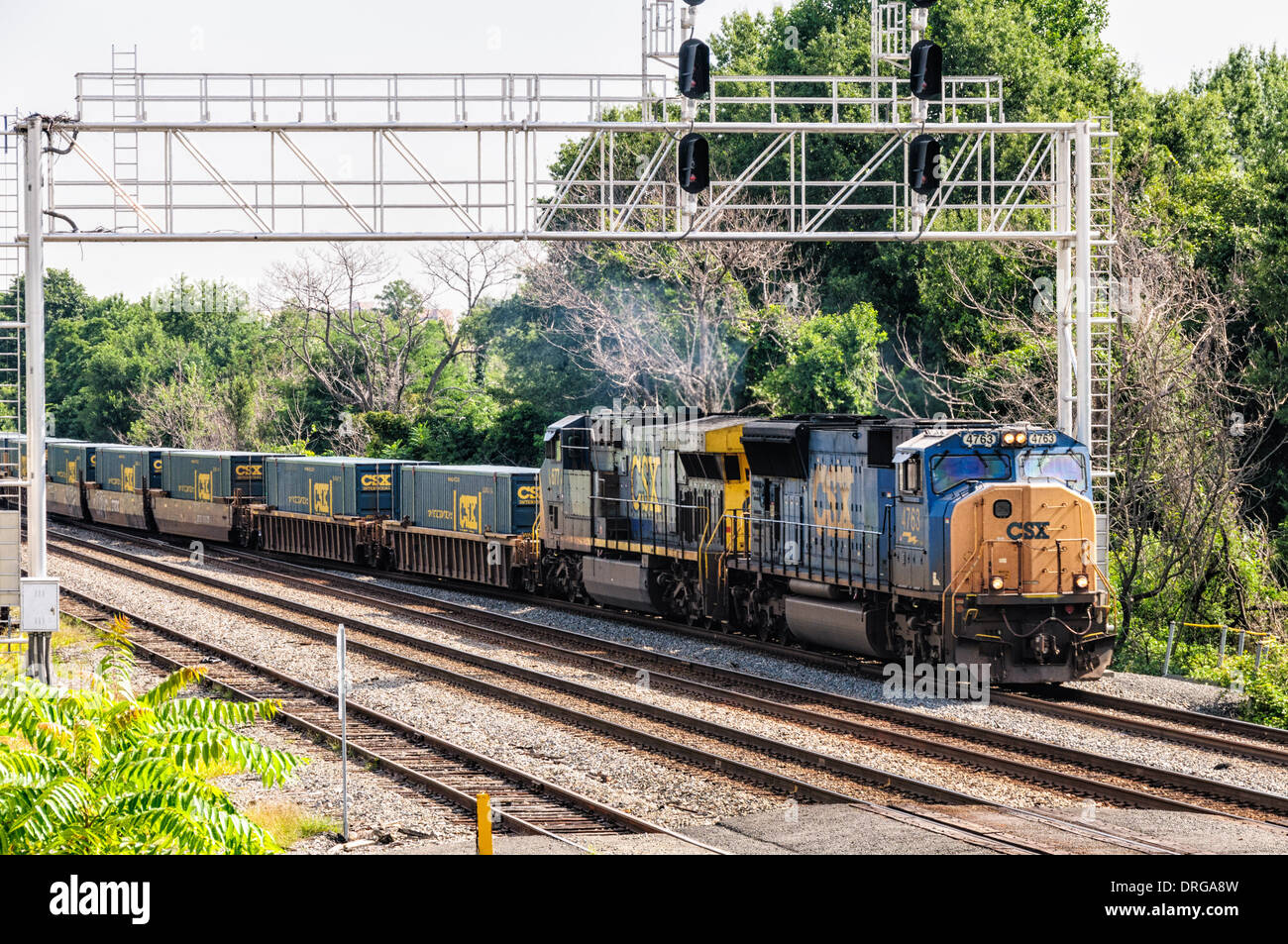 CSX Locomotives EMD SD70MAC No 4763 and GE CW44-6 No 677 on intermodal freight duty passing ...