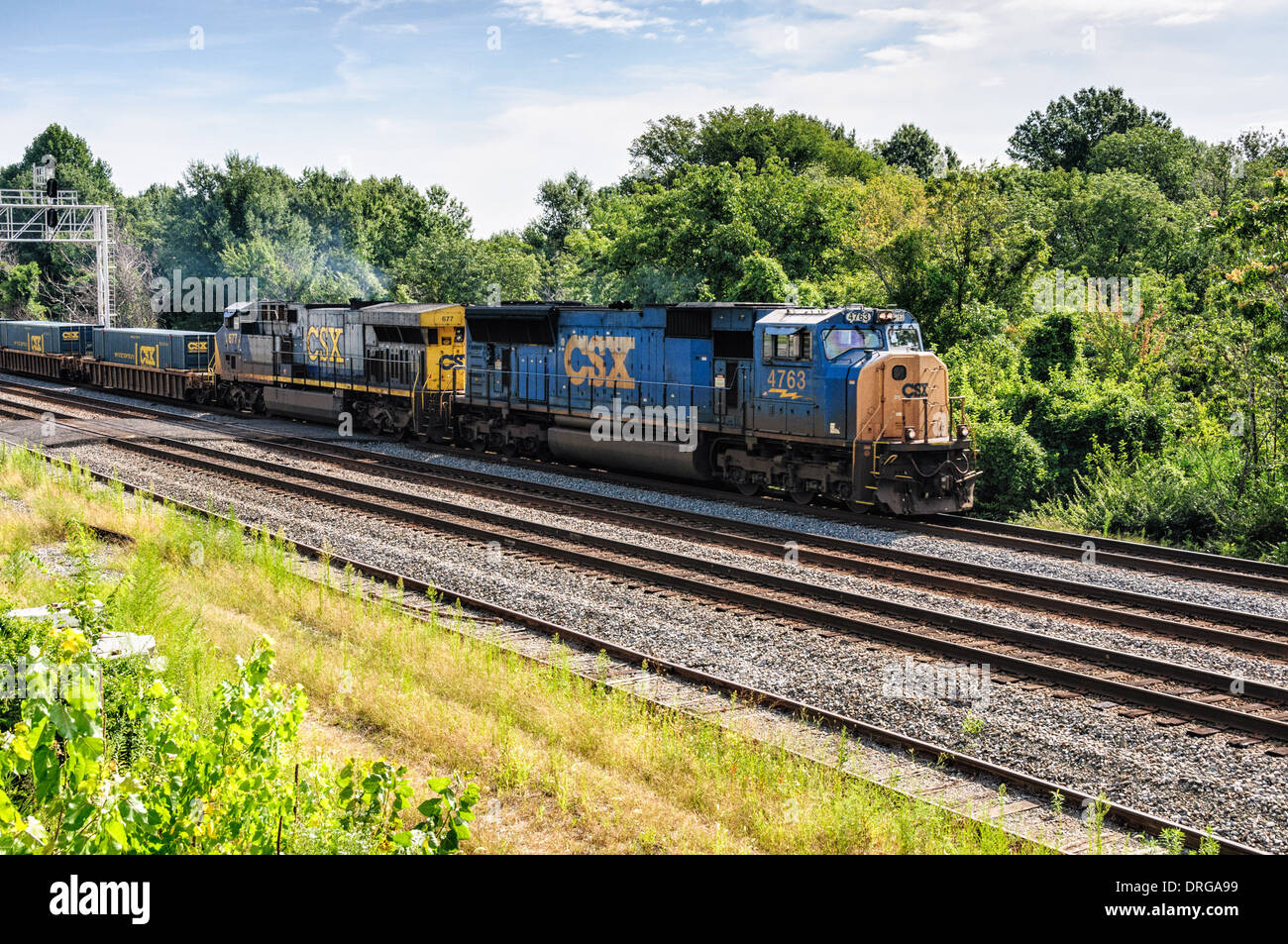 CSX Locomotives EMD SD70MAC No 4763 and GE CW44-6 No 677 on intermodal freight duty passing ...