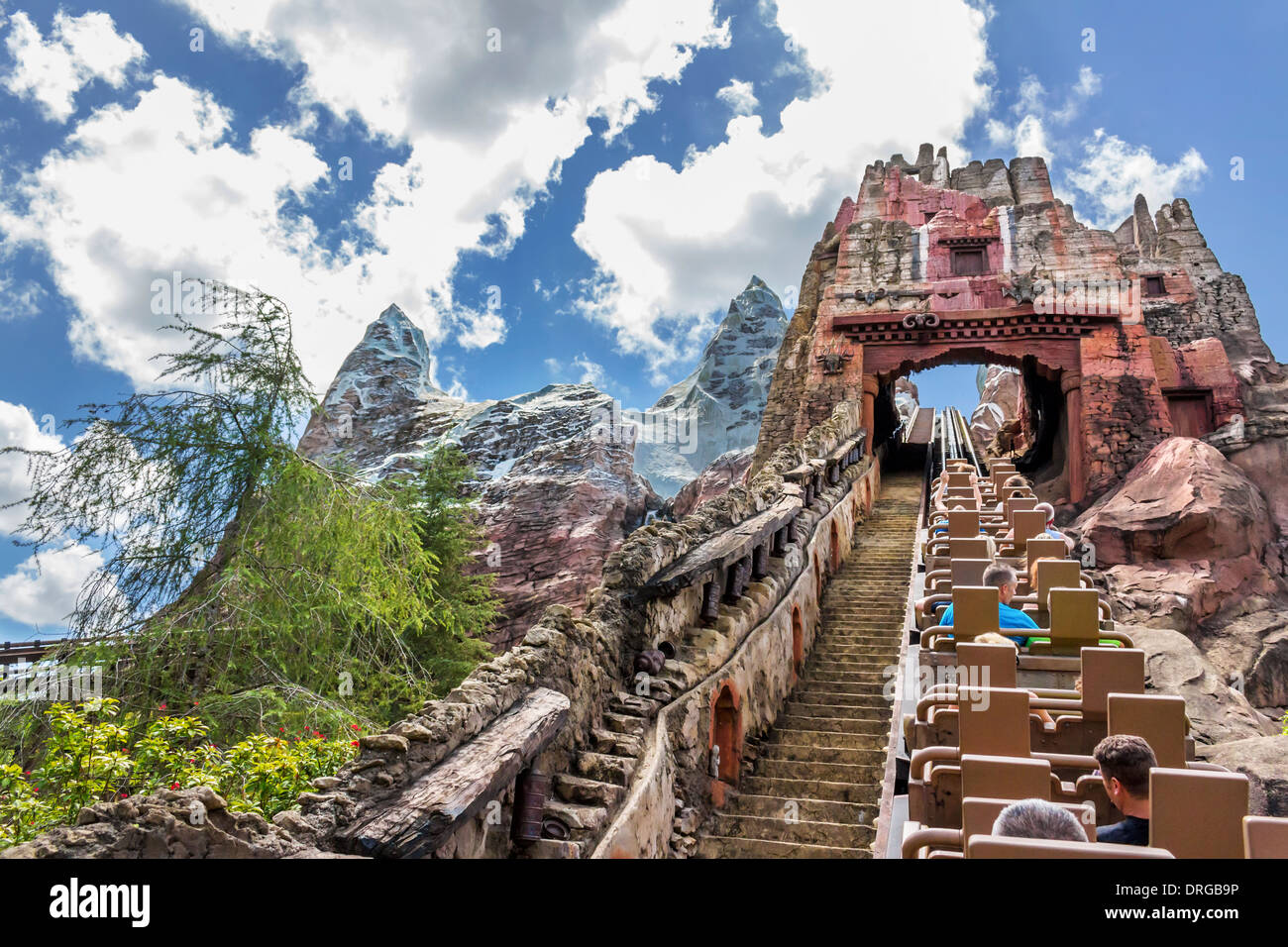 Visitors, families, children, people having fun on a Roller coaster in ...