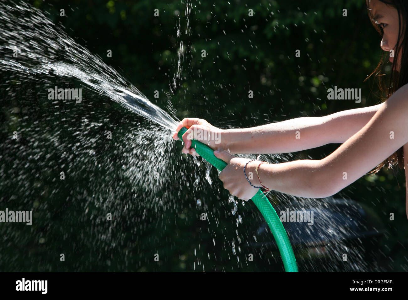child playing with water Stock Photo - Alamy