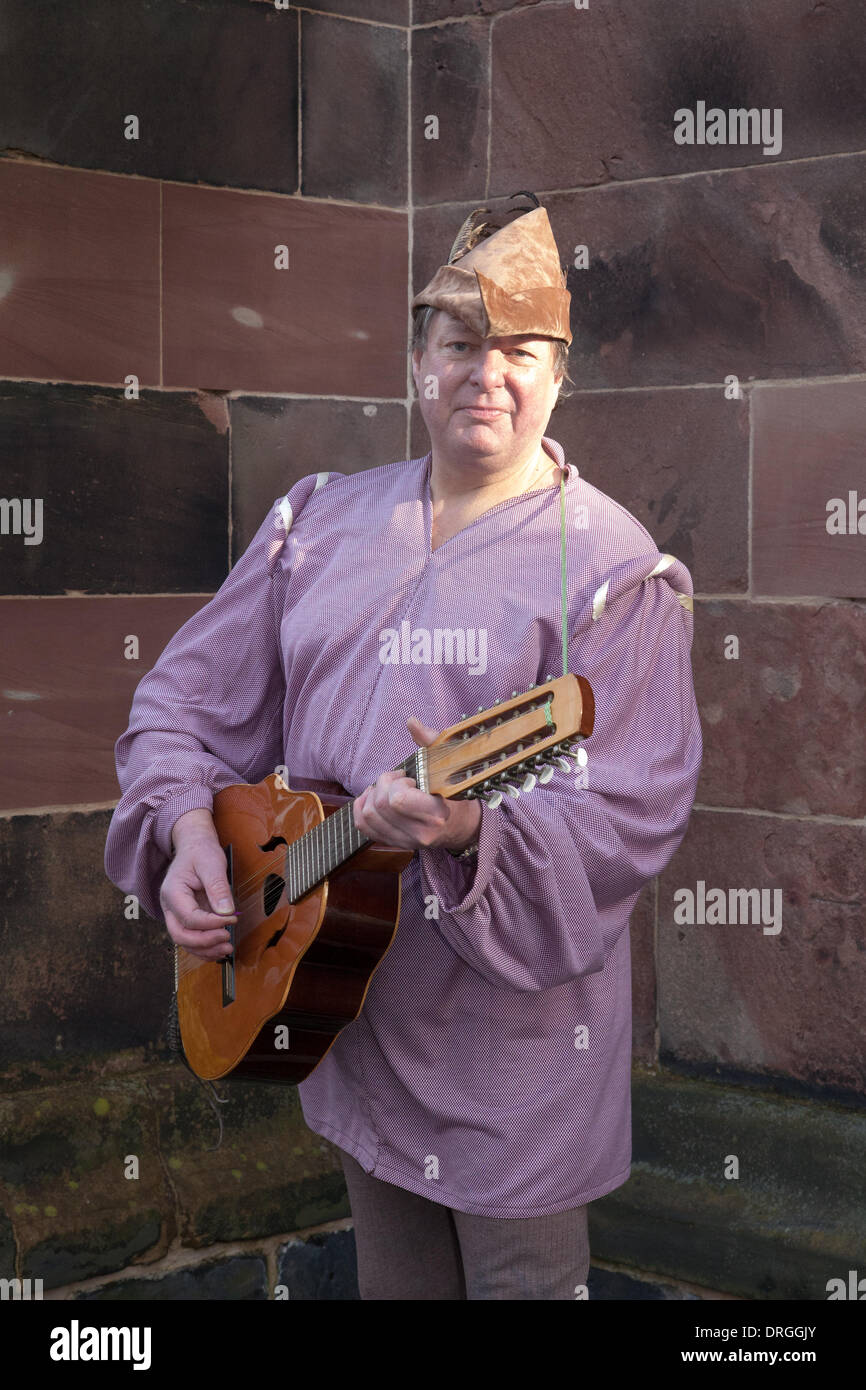 Nantwich, Cheshire, UK. 25th Jan, 2014. Ron Snell playing a Laud string ...