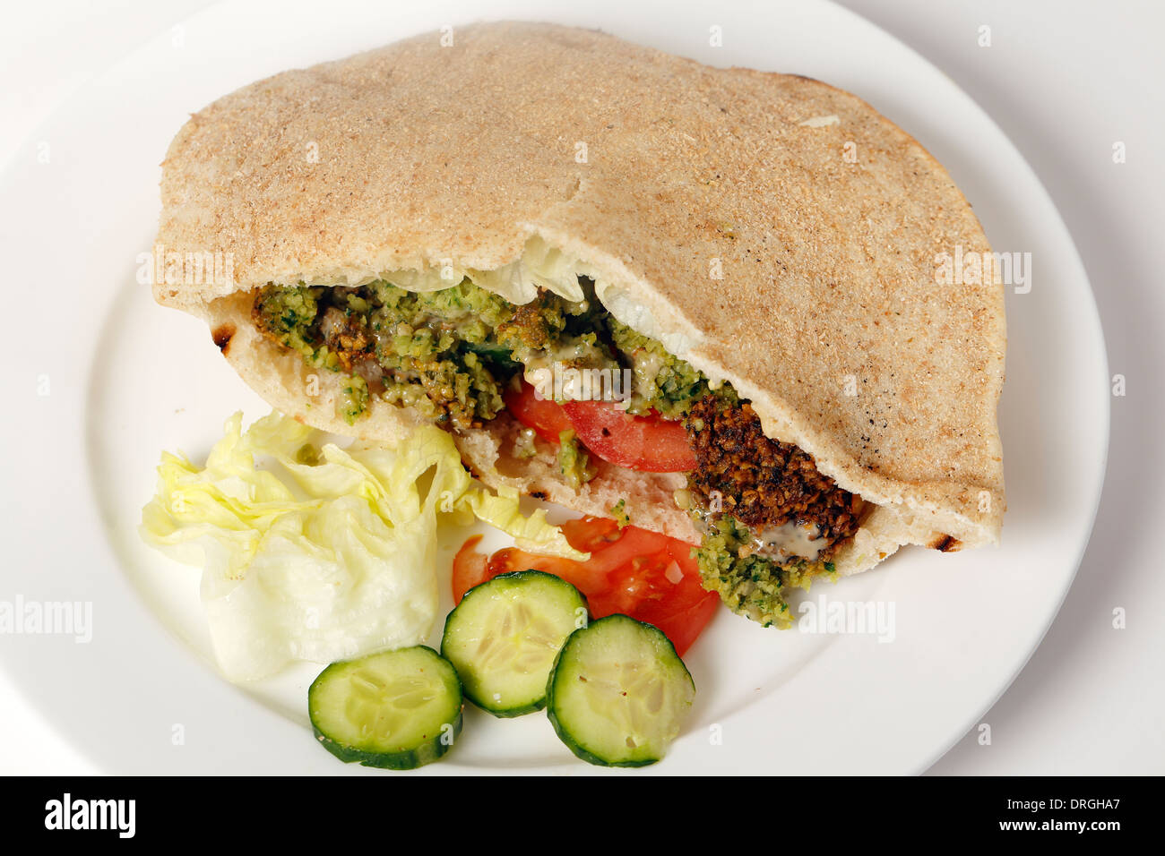 Egyptian flat bread stuffed with salad and falafels, a traditional fast ...