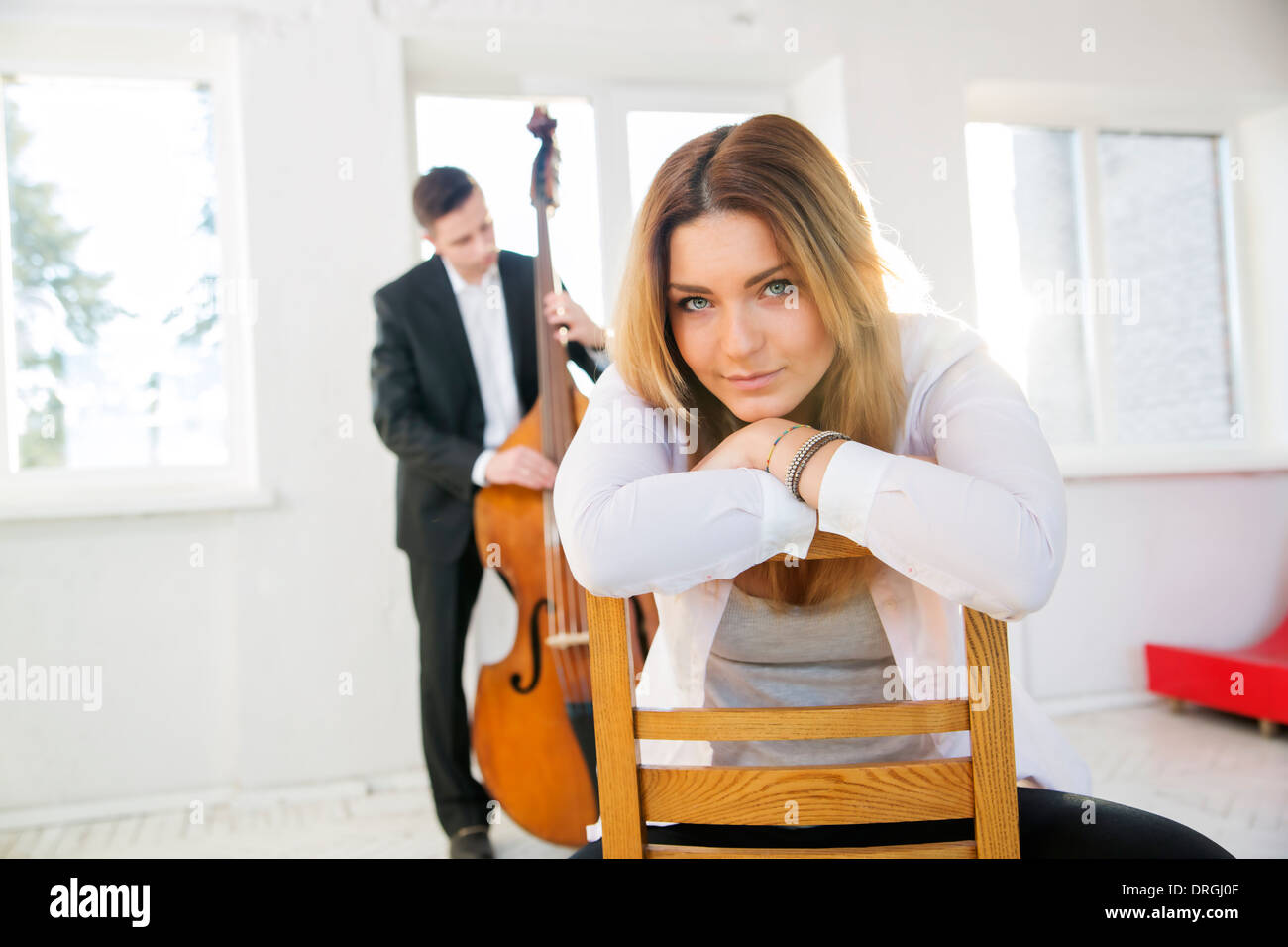 Beautiful woman backwards on chair hi-res stock photography and images ...