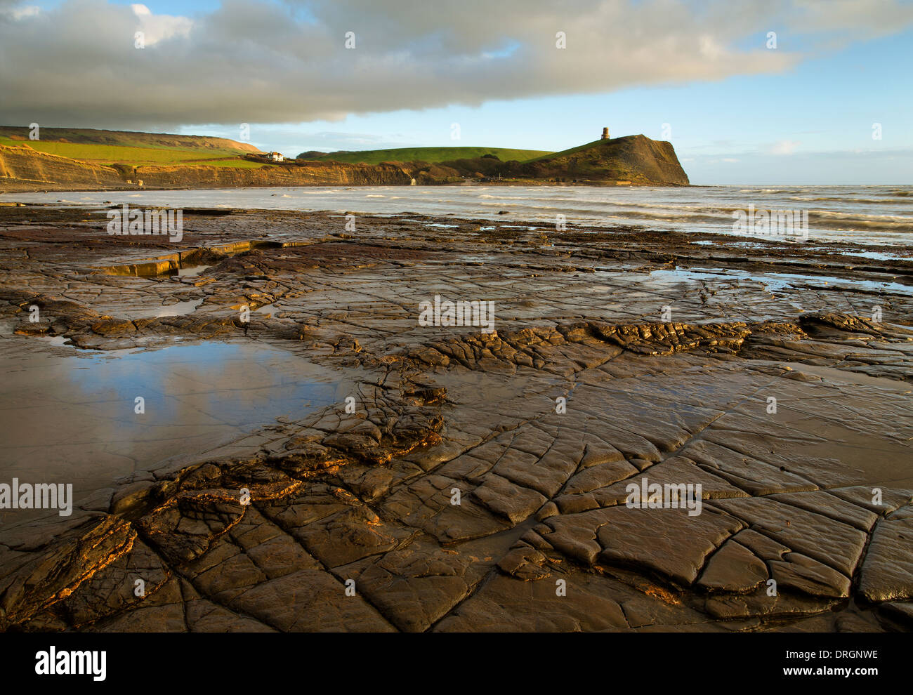 Late evening sun highlights the rock ledges and tidal pools at ...