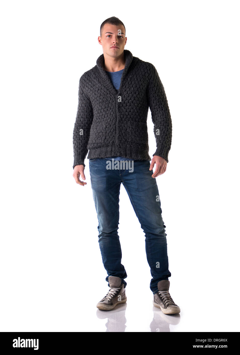 Full body shot of attractive young man with wool sweater and jeans ...