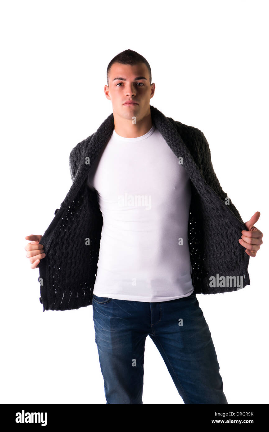 Attractive young man with open wool sweater and jeans, isolated on ...