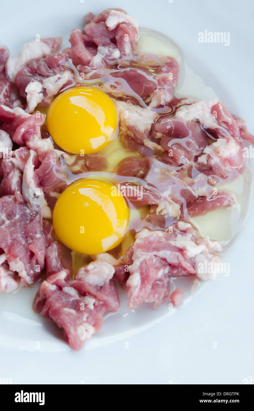 raw meat and fresh sliced pork , yolk egg prepare for cooking Stock ...