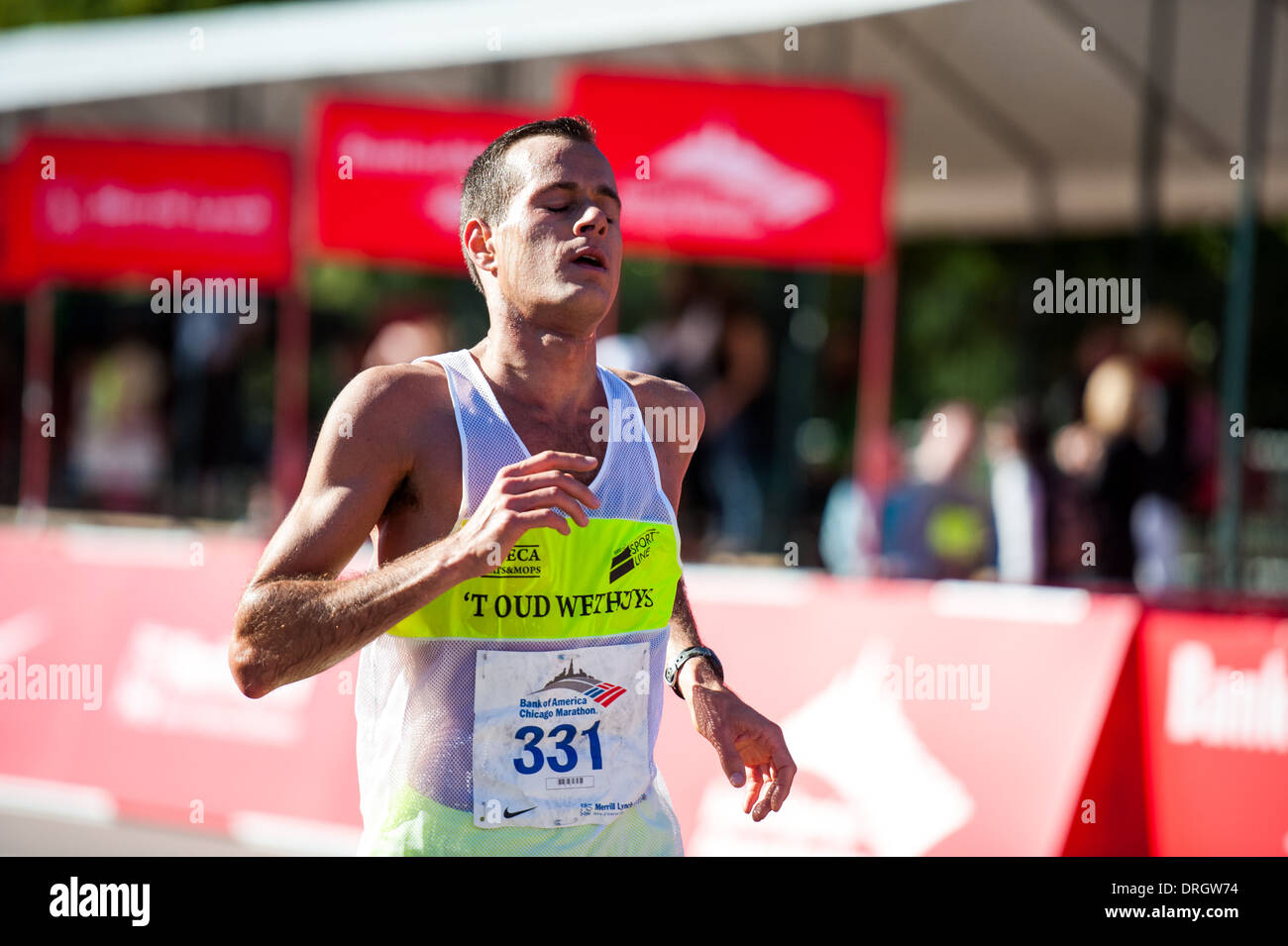 An elite runner crosses the finish line at the Bank of America Chicago ...