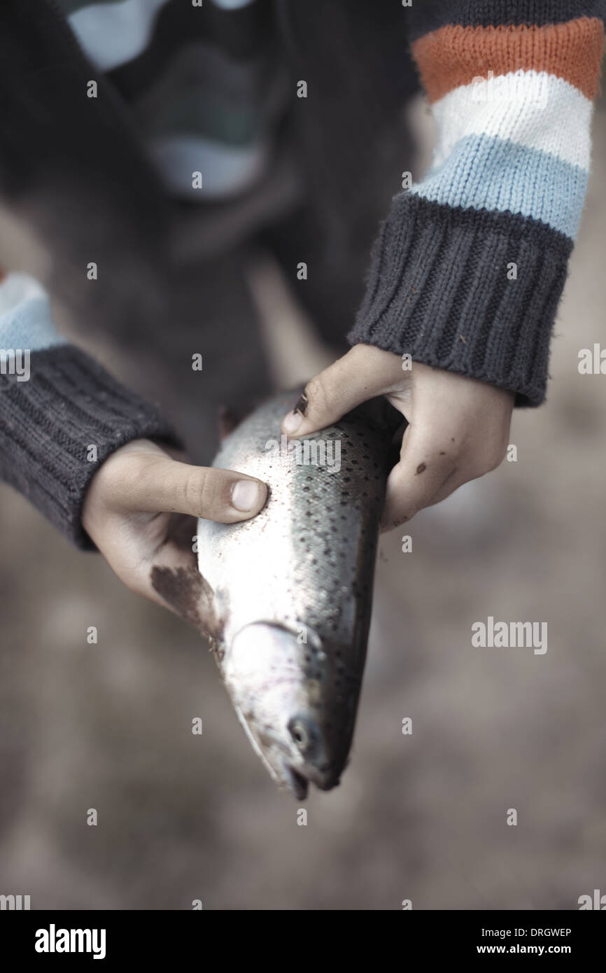 Man holding dead fish hi-res stock photography and images - Alamy