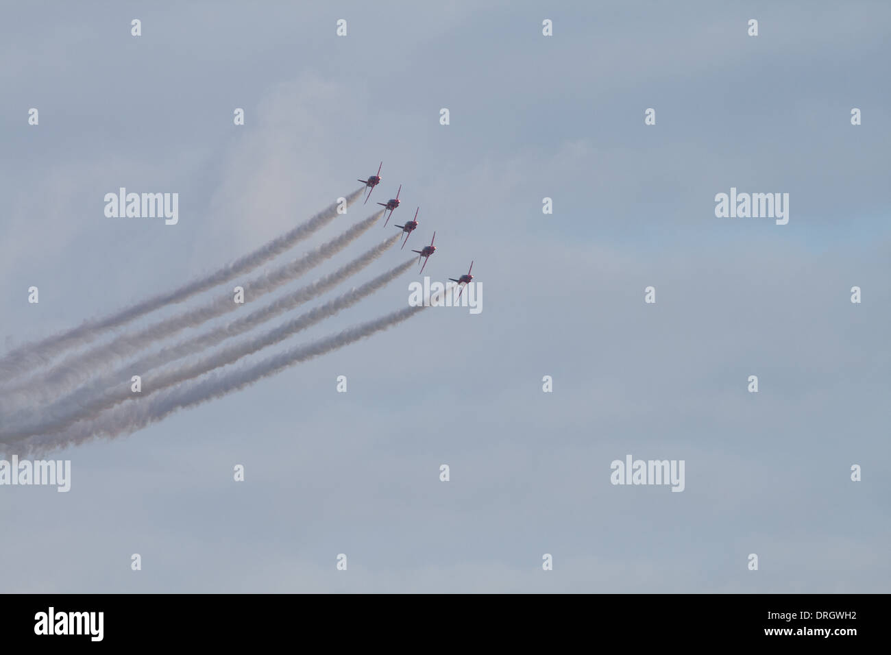 Five Red Arrows in Formation Stock Photo - Alamy