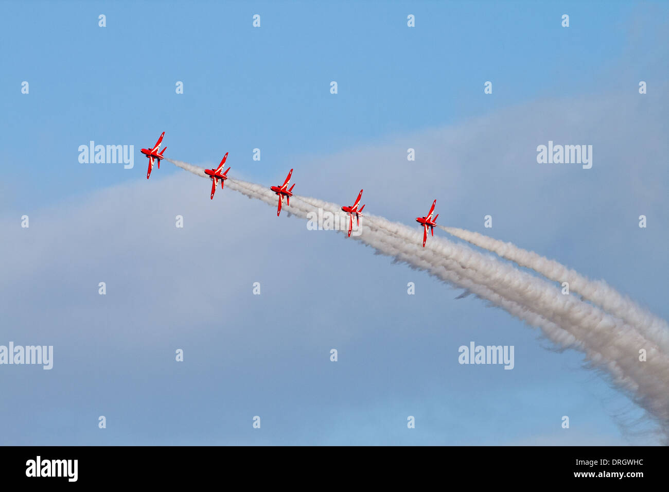 Five Red Arrows in Formation Stock Photo - Alamy
