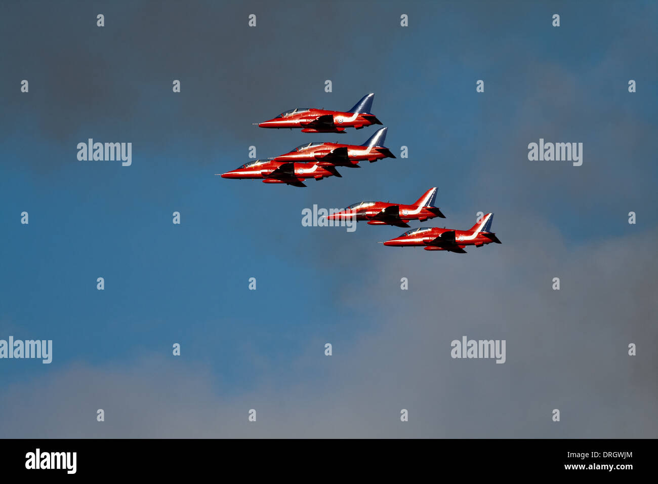 Five Red Arrows in Formation Stock Photo - Alamy