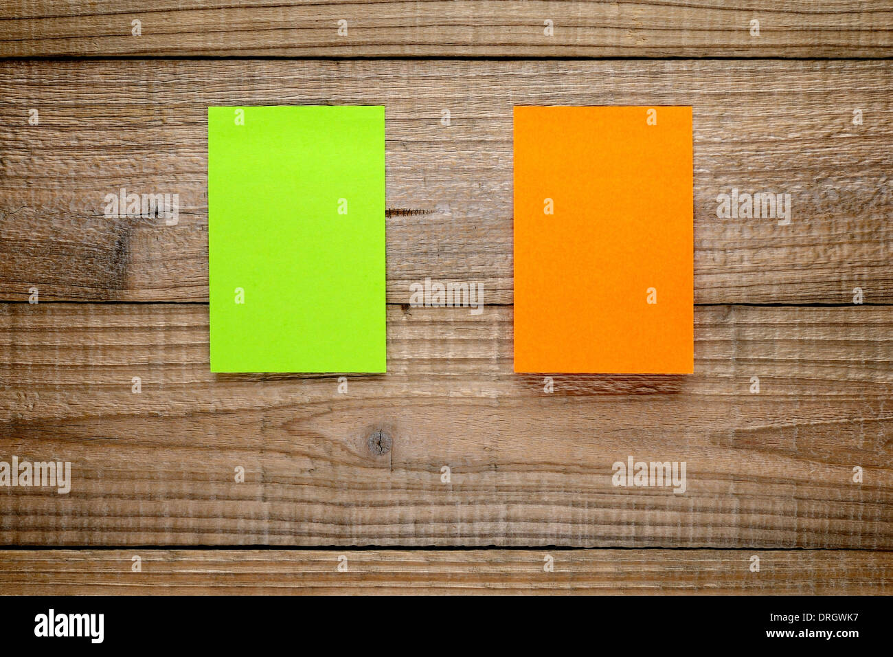 Two post-it notes on wooden background Stock Photo - Alamy