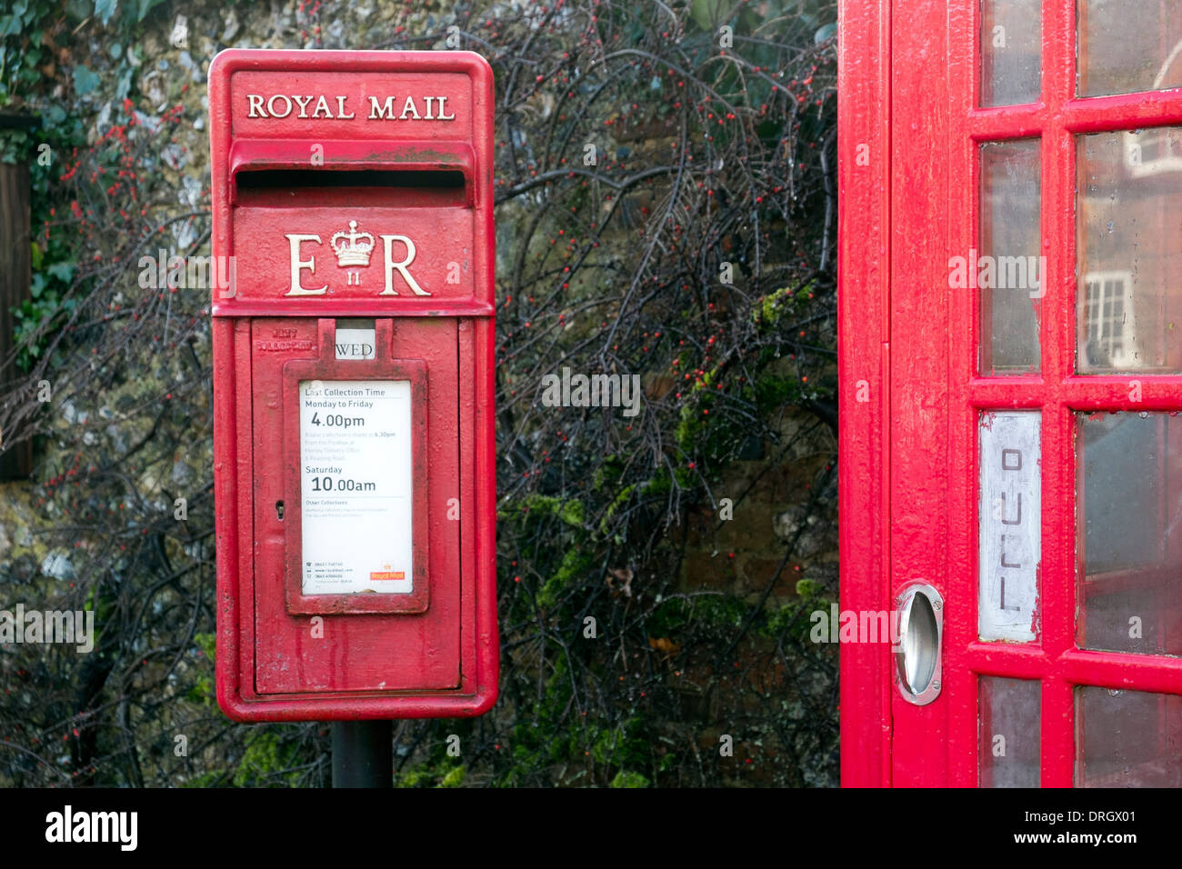 Traditional wall mounted red letter collection and phone box Turville ...