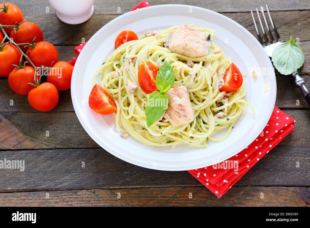 spaghetti with fish and tomatoes, food closeup Stock Photo - Alamy