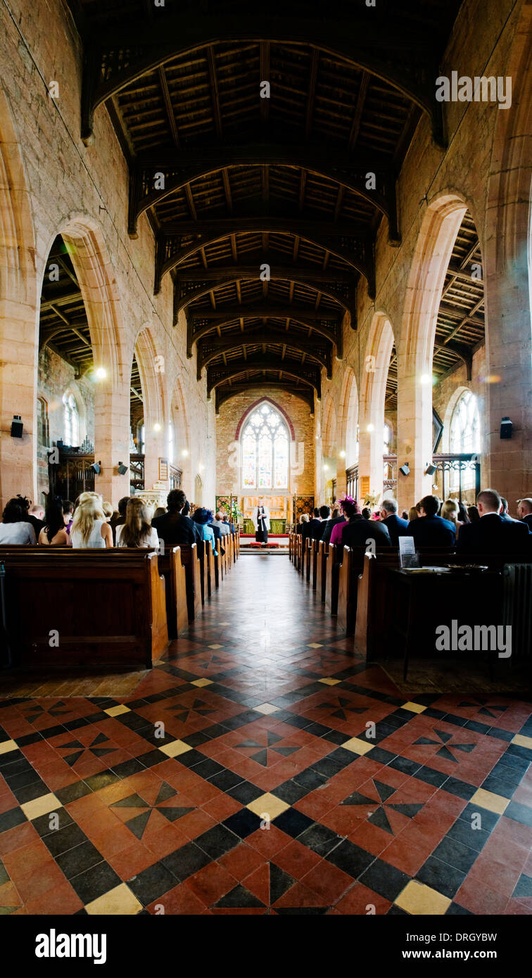 The vicar conducts a wedding ceremony at a traditional English wedding ...