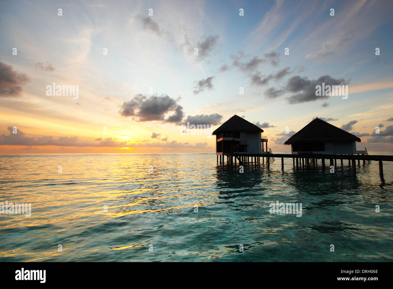 resort maldivian houses on sunrise Stock Photo - Alamy