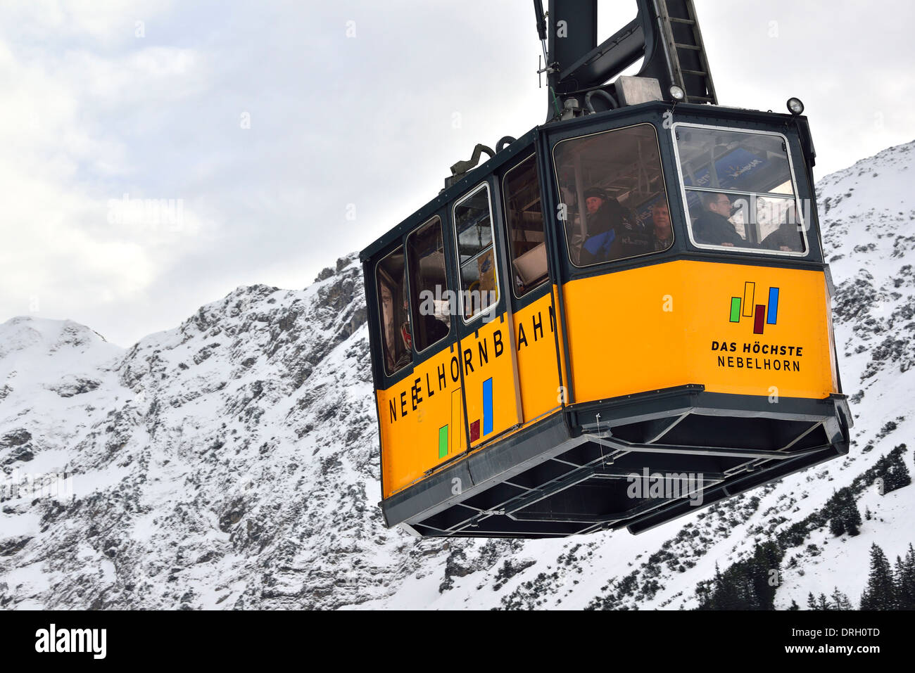 Nebelhorn or Nebelhornb Cable Car in winter taking skiers and tourists ...