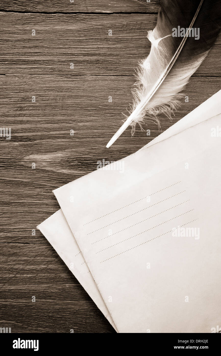 ink pen with envelope on vintage wood background texture Stock Photo ...