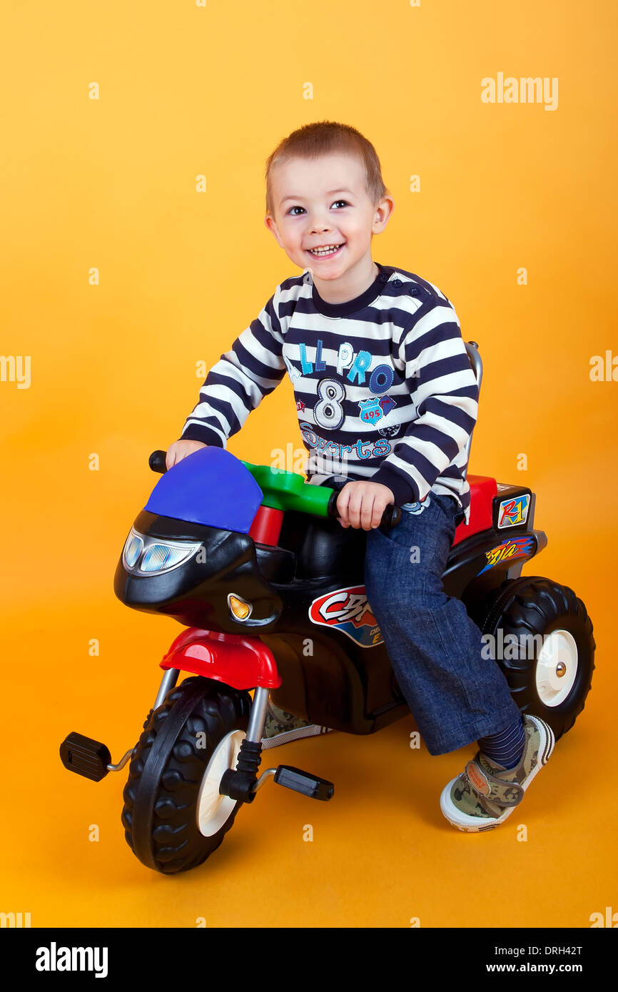 Kid and bicycle and motorbike hi-res stock photography and images - Alamy