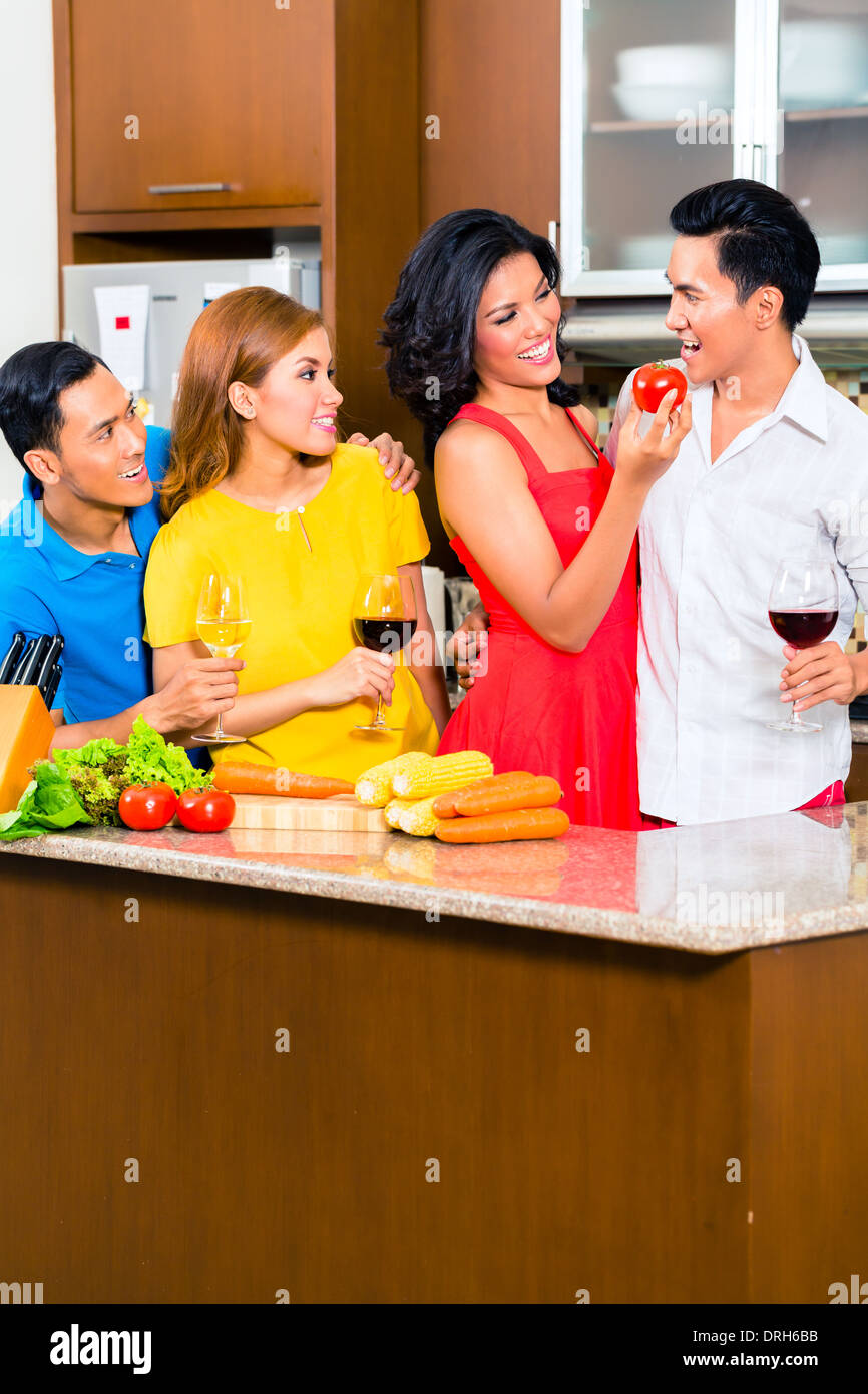 Two friends cooking together home hi-res stock photography and images ...