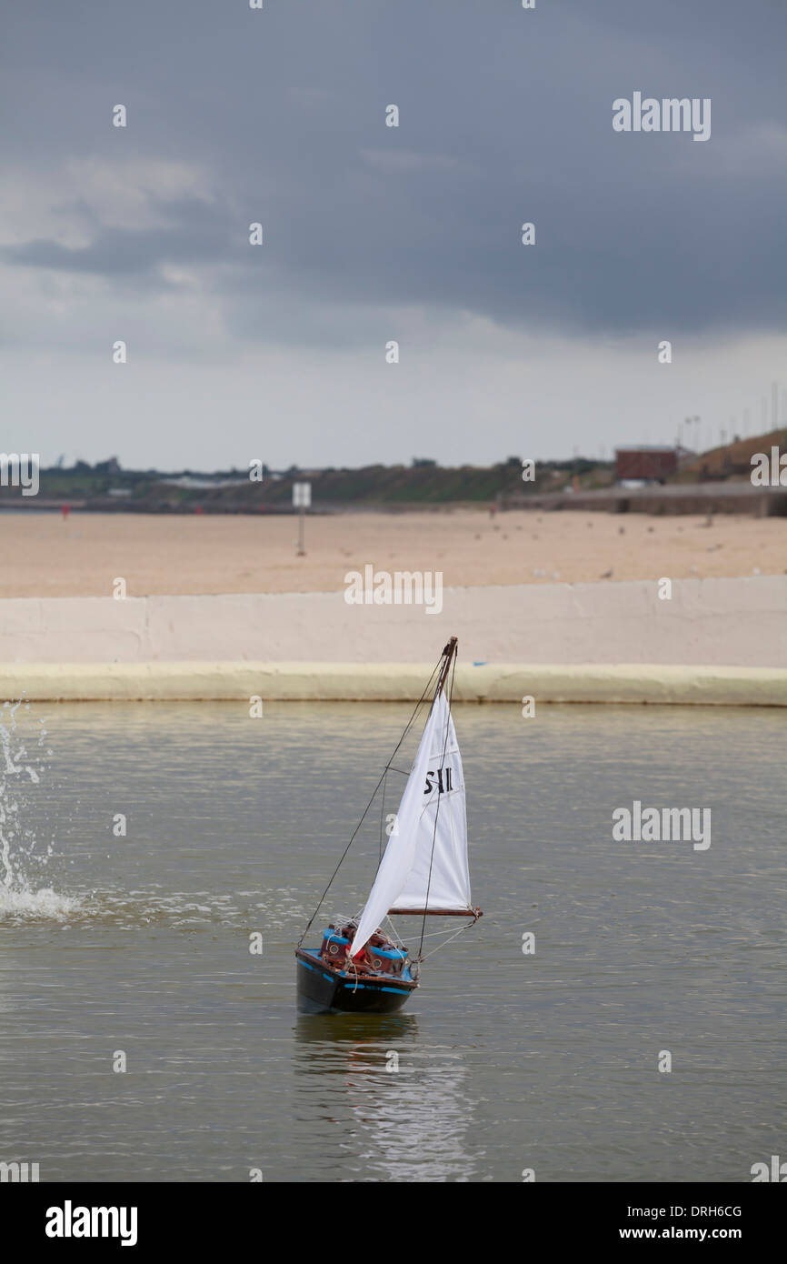 Handmade model yacht free sailing Stock Photo - Alamy