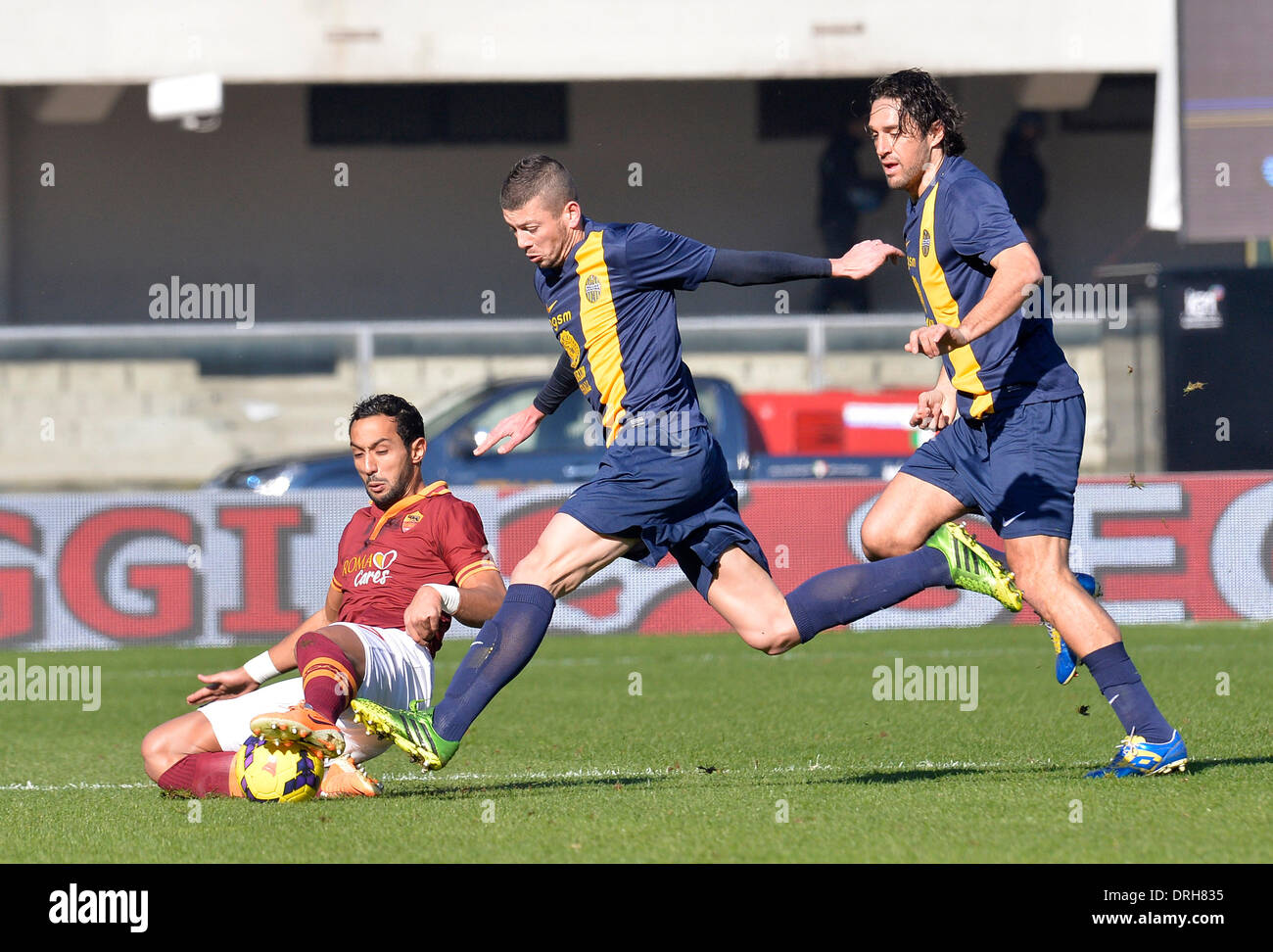 Verona, Italy. 26th Jan, 2014. AS Roma's Mehdi Benatia (L) vies with ...