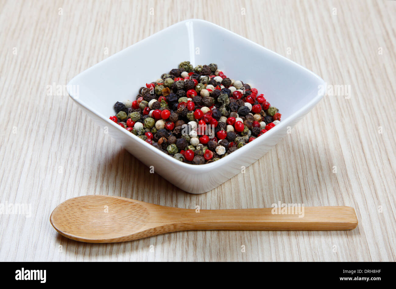 Red, white and black pepper in a dish Stock Photo - Alamy