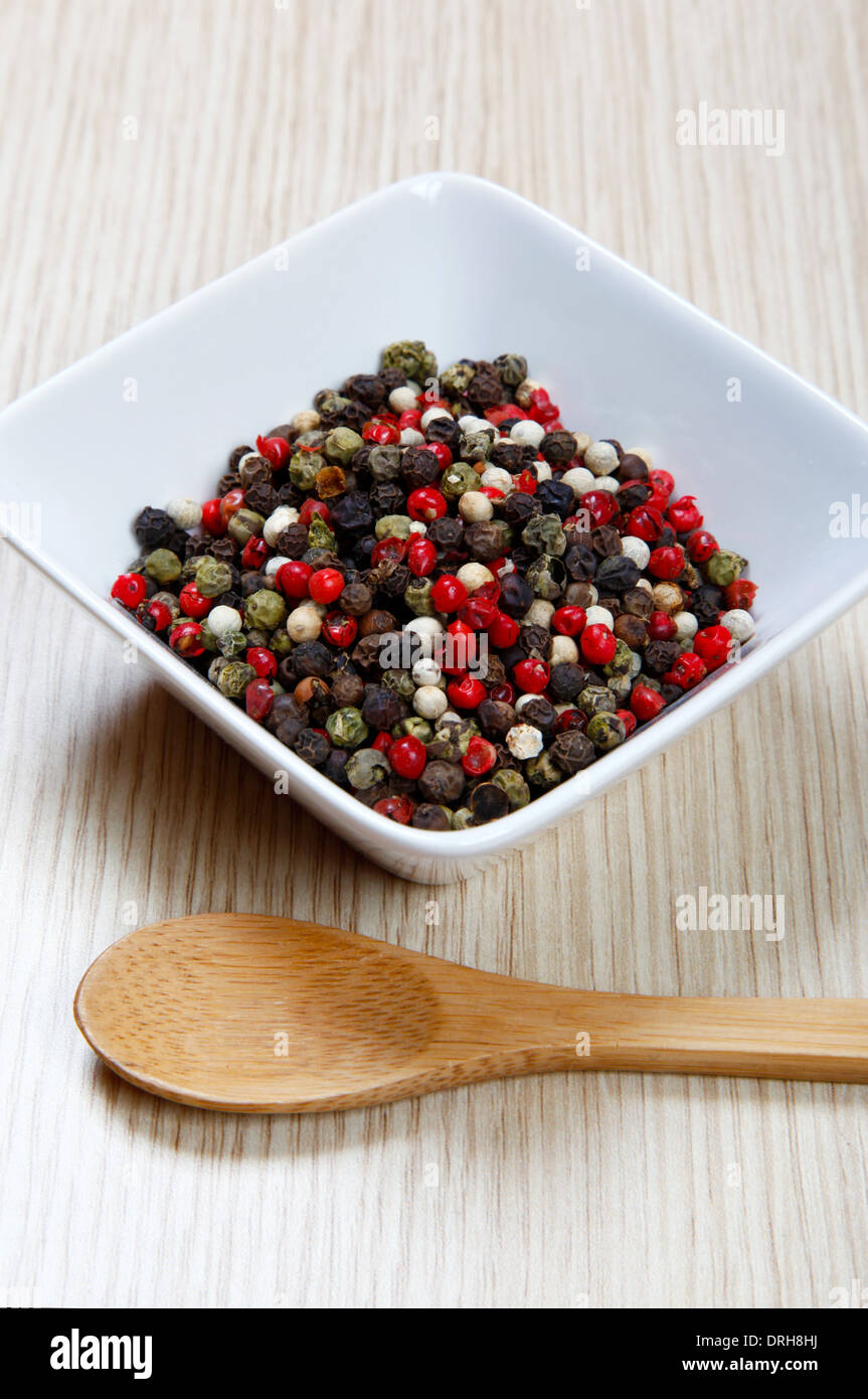Red, white and black pepper in a dish Stock Photo - Alamy