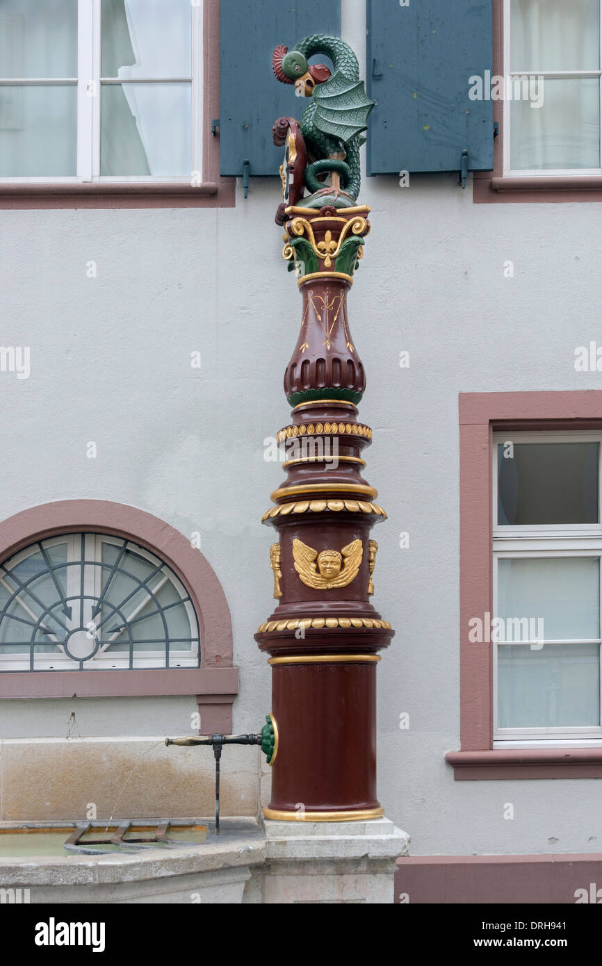 Restored fountain topped by a cute small dragon hi-res stock ...