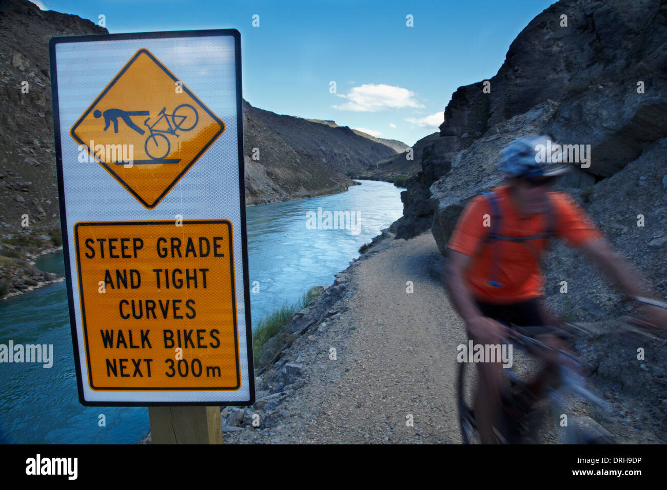 Mountain biker and warning sign on Roxburgh Gorge Cycle and Walking ...