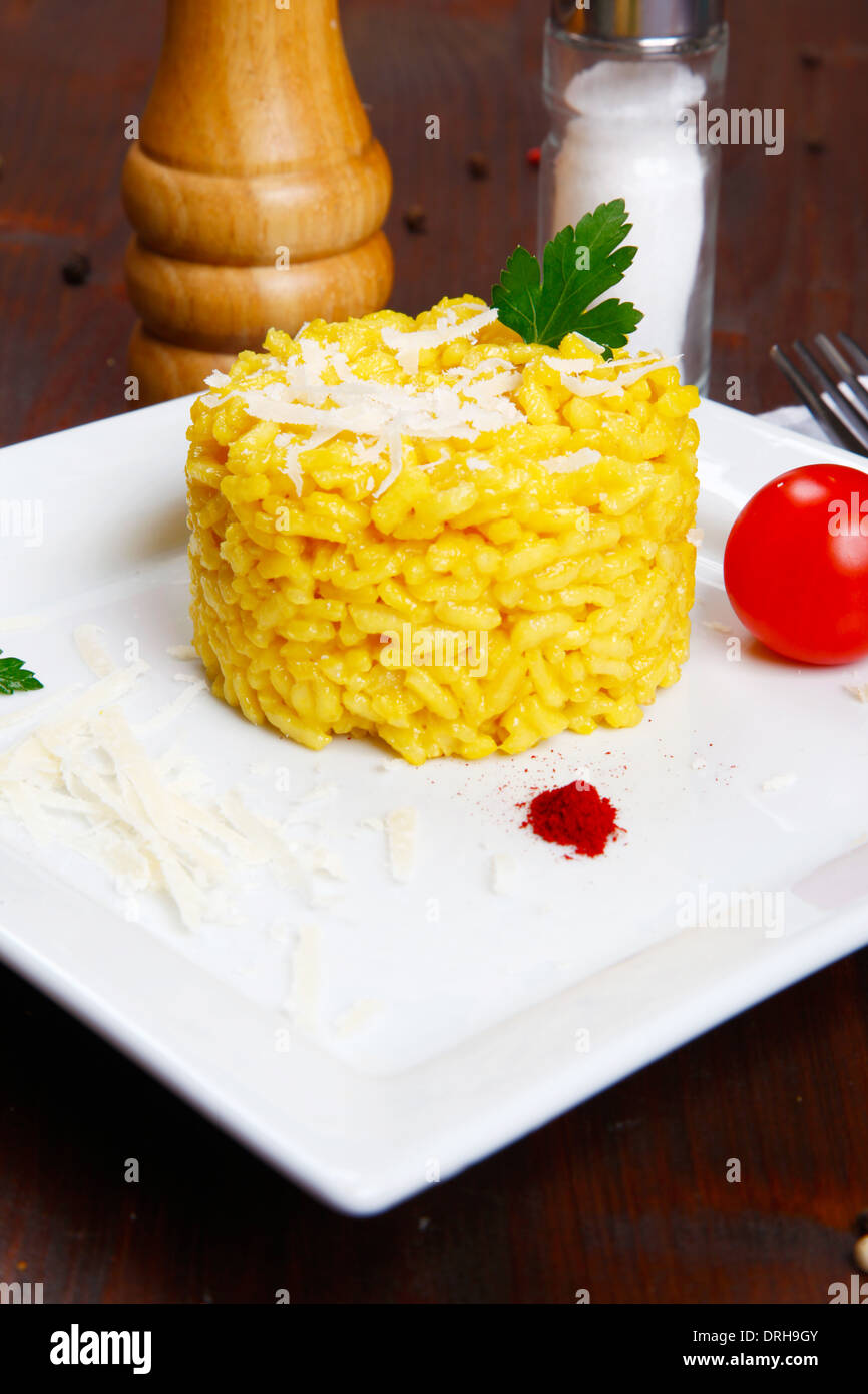 risotto with saffron on a dish Stock Photo - Alamy