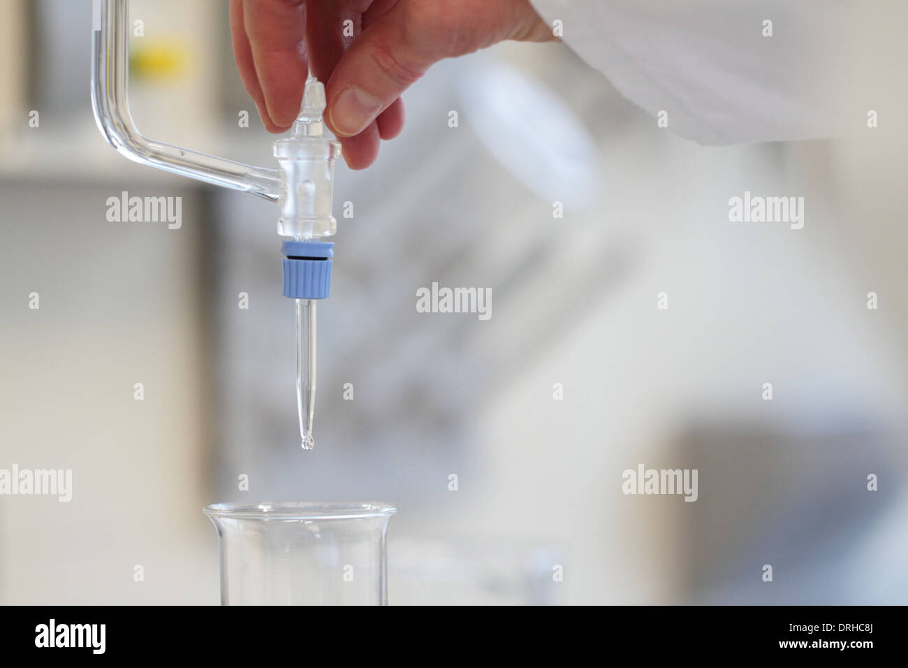 hand opens a burette Stock Photo - Alamy