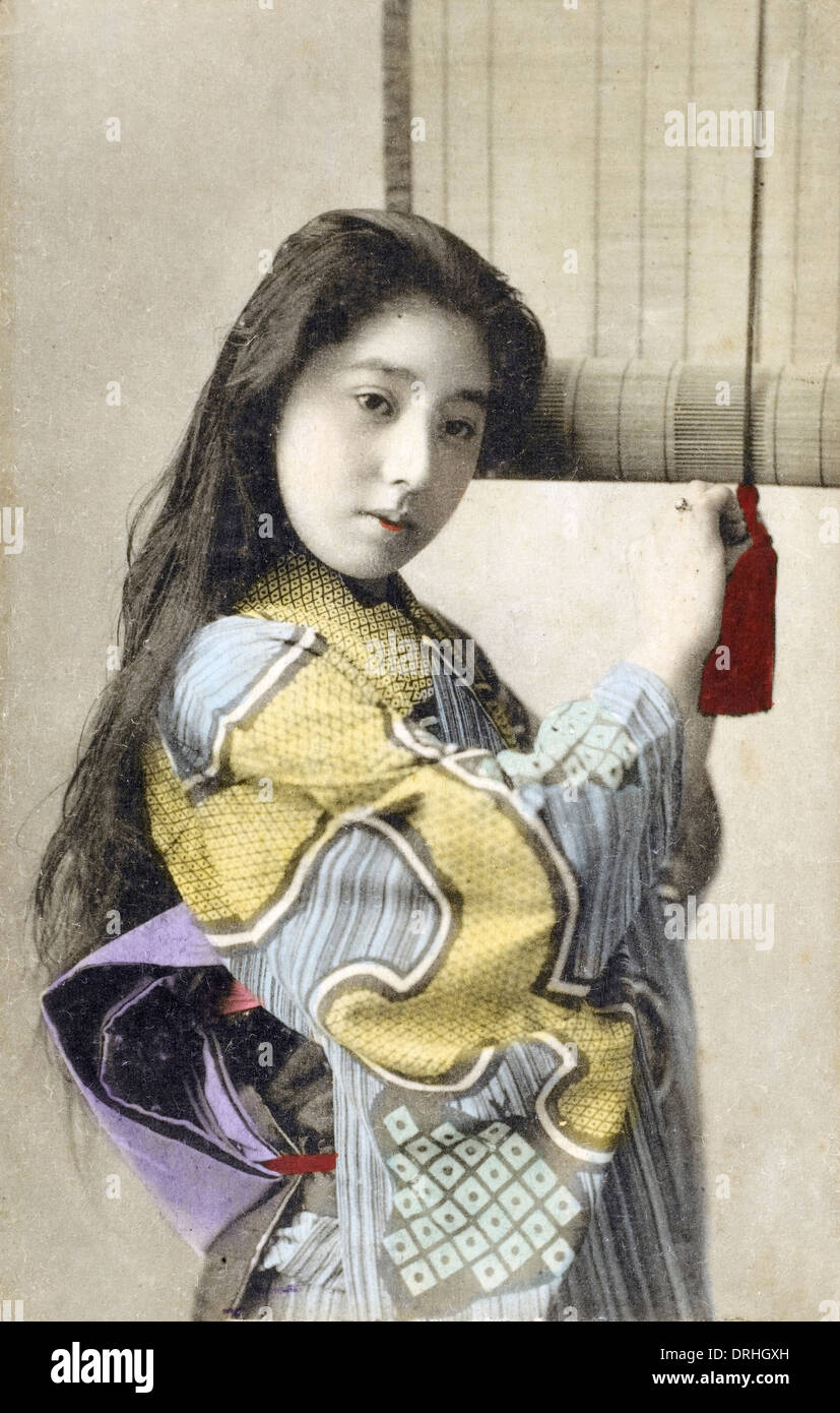 Pretty Japanese girl and roll blind Stock Photo - Alamy