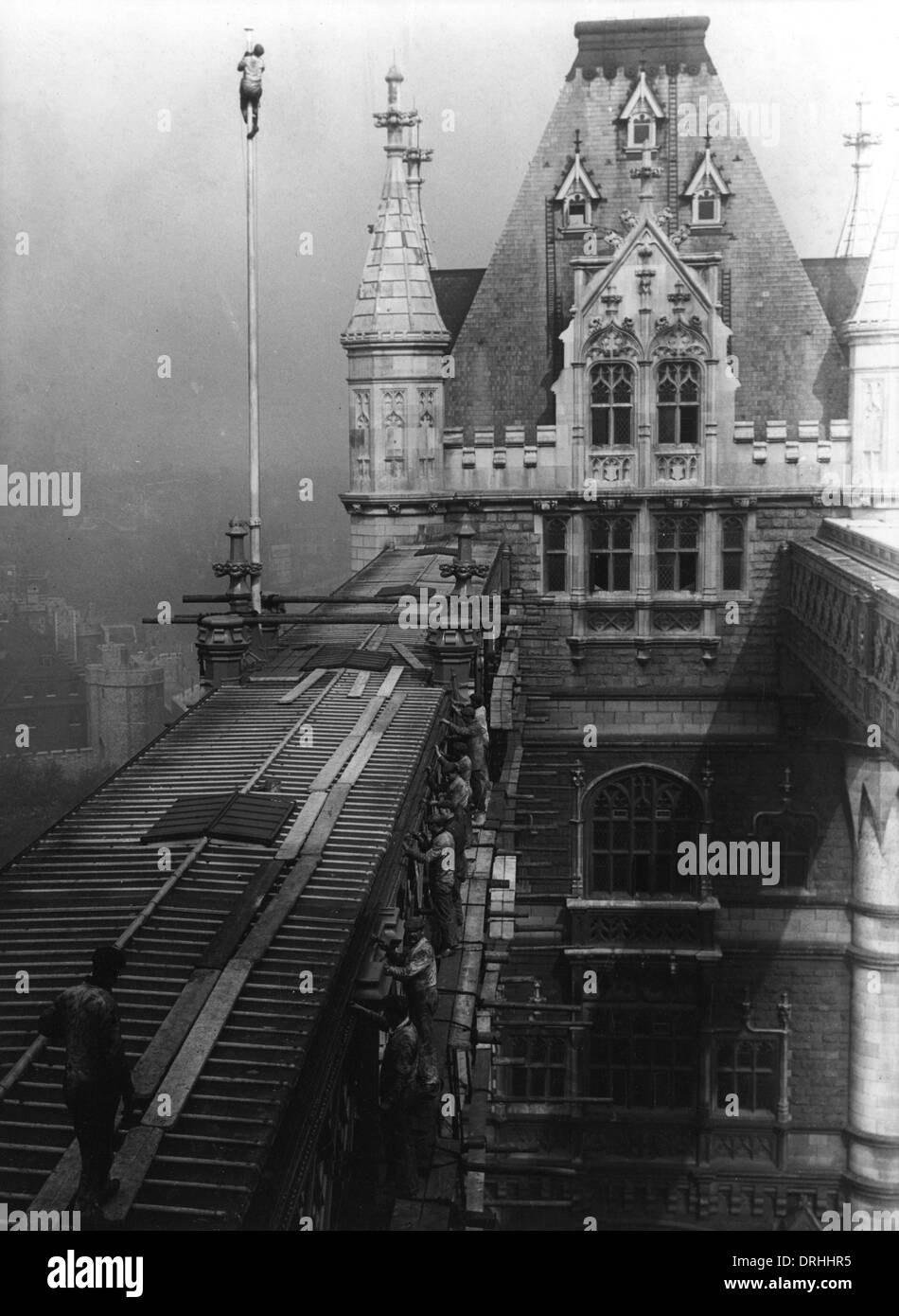 Workmen repairing part of the walkways on Tower Bridge Stock Photo - Alamy